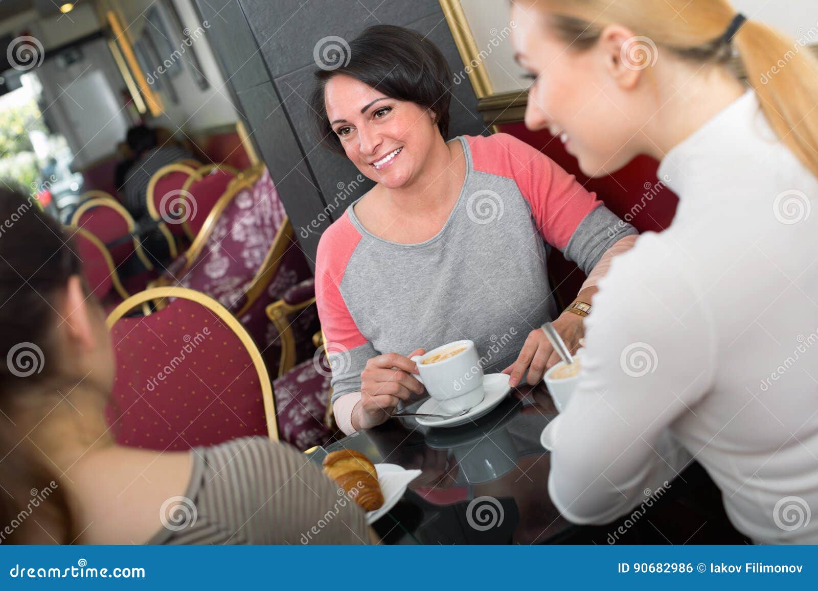 Group of Women Taking a Conversation Over a Cup of Coffee Stock Photo ...