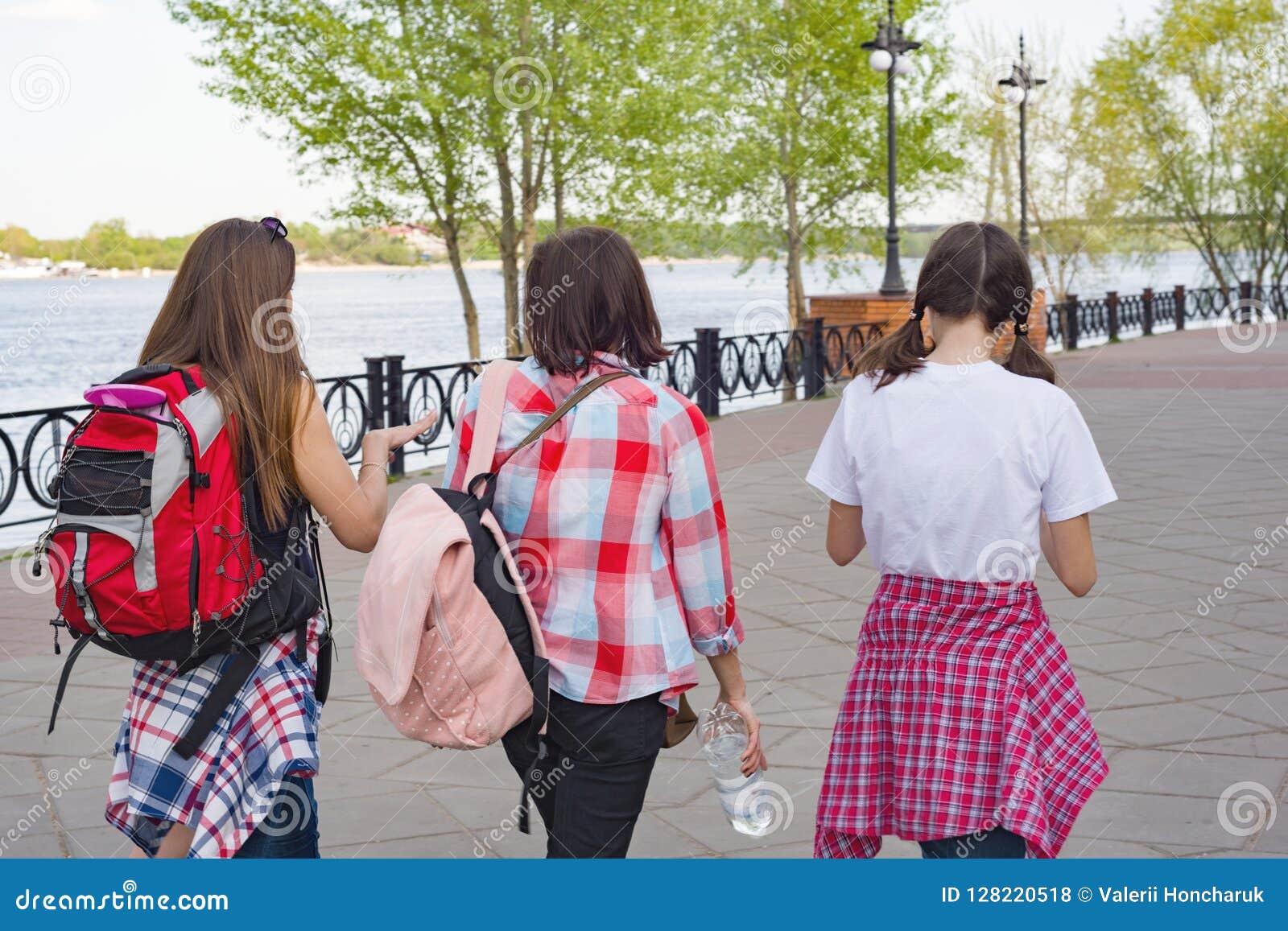 Group of Women Walking in the Park. Urban Background, River, Sky Stock ...