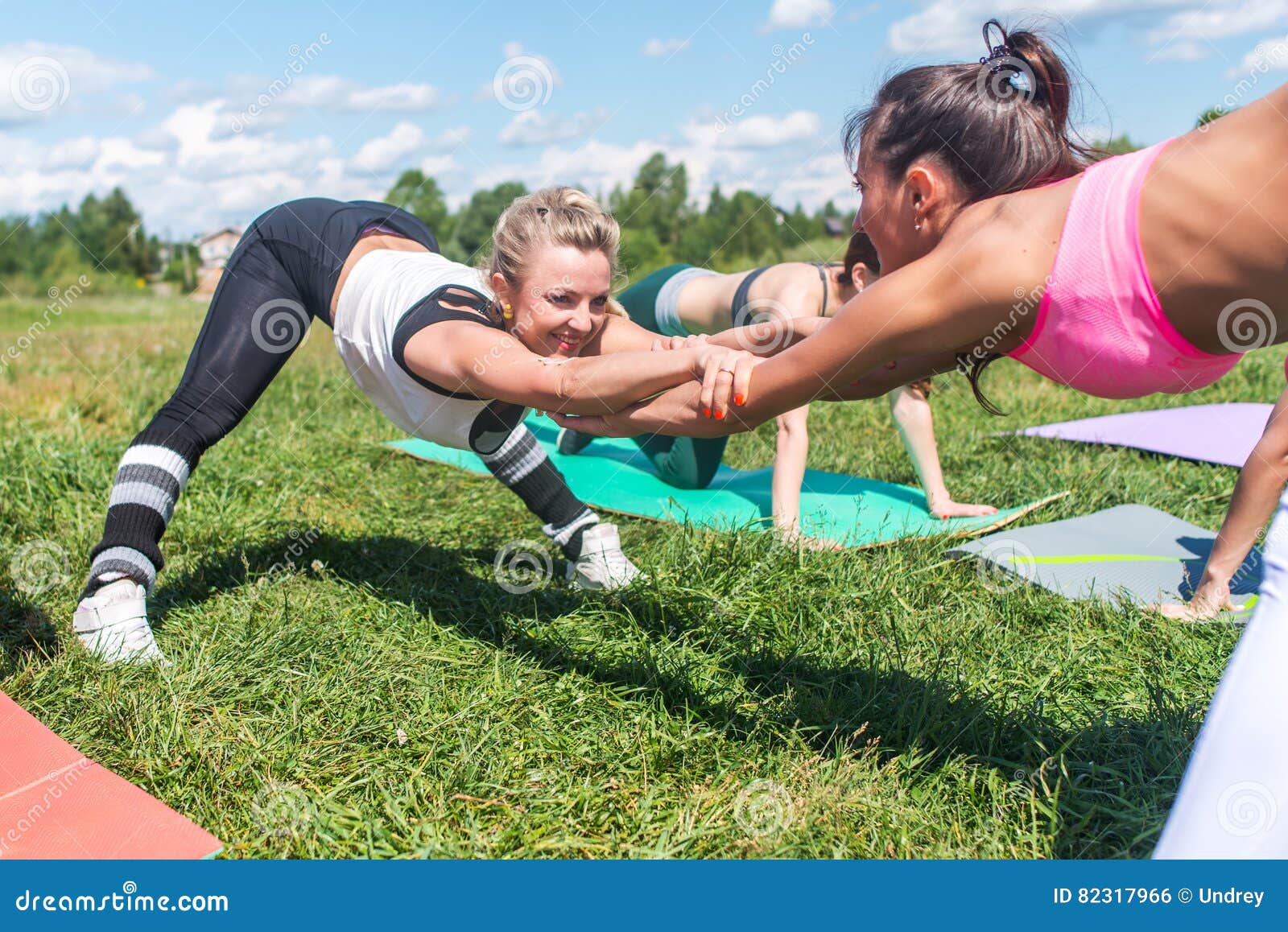 Group Women Warming Up before Training Stretching, Exercising Outdoors ...