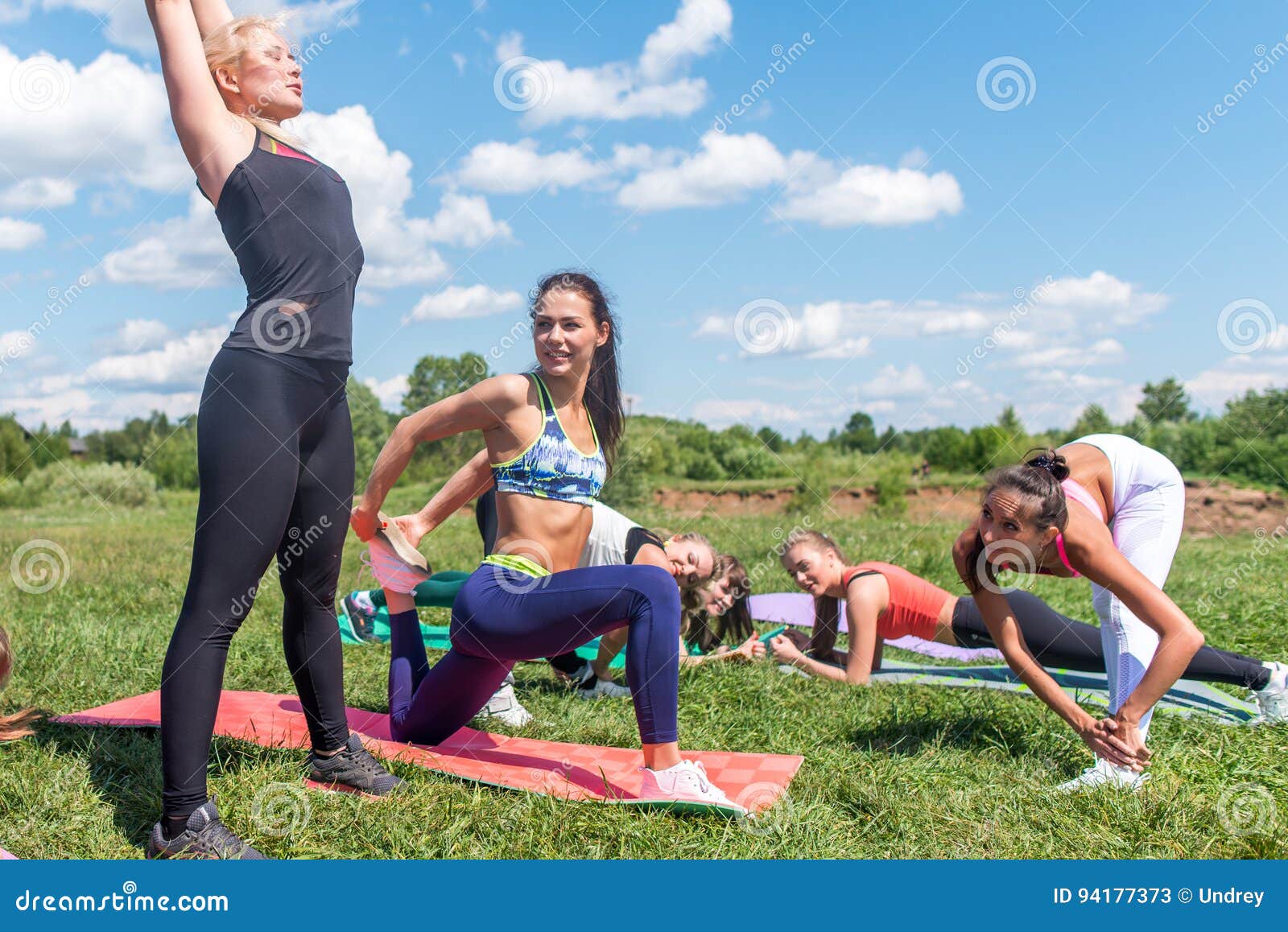 Group Women Warming Up before Training Stretching, Exercising Outdoors ...