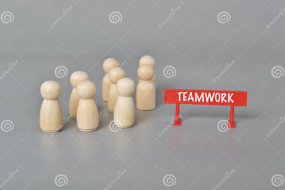 A Group of Wooden Figure with Text TEAMWORK. Unity and Teamwork in ...