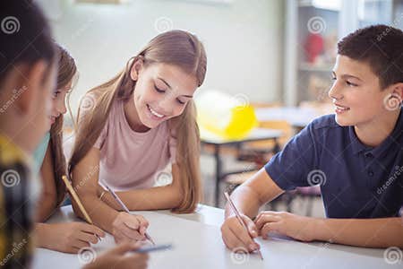 Group work in class stock image. Image of cheerful, focus - 215648367
