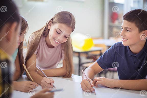 Group work in class stock image. Image of cheerful, focus - 215648367