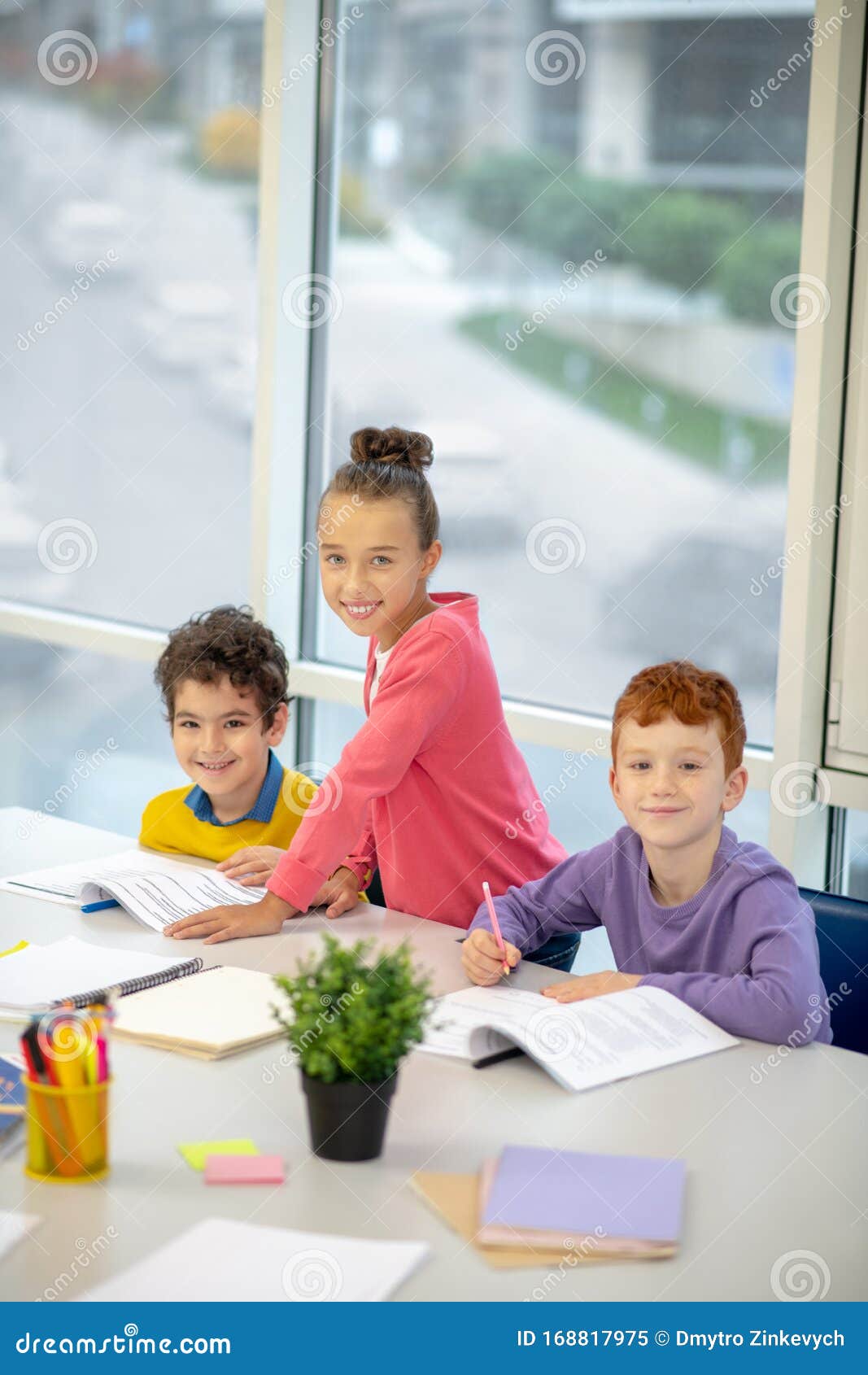 Three Happy Kids Doing Group Task Together Stock Image - Image of ...