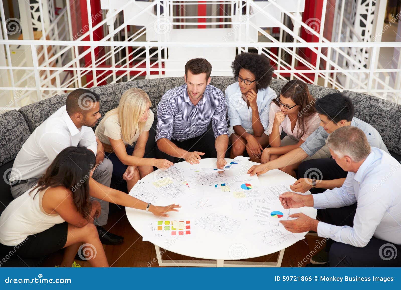 Group of Work Colleagues Having Meeting in an Office Lobby Stock Photo ...