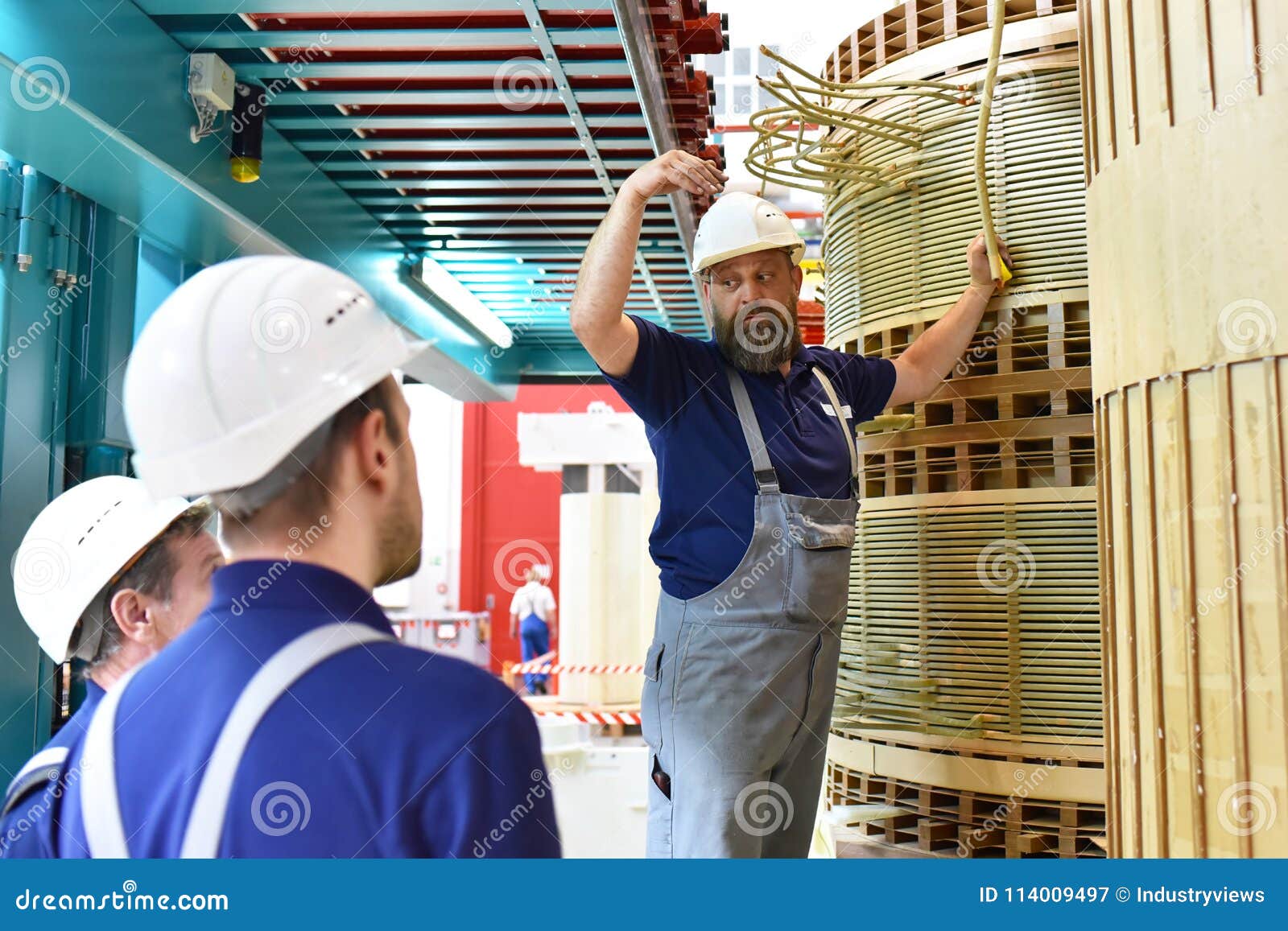 Group Worker Assembles a Transformer in Mechanical Engineering - Stock ...