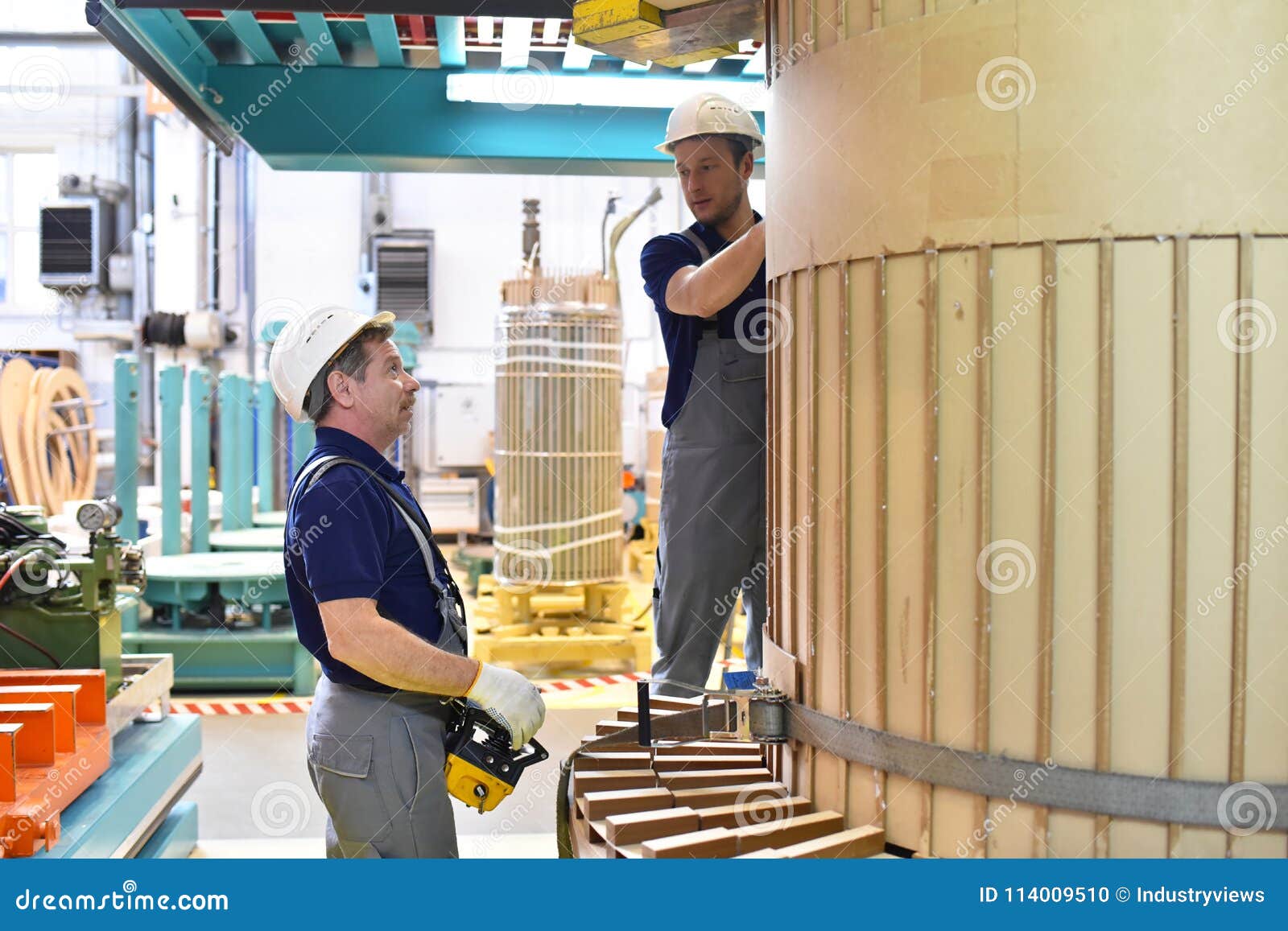 Group Worker Assembles a Transformer in Mechanical Engineering - Stock ...
