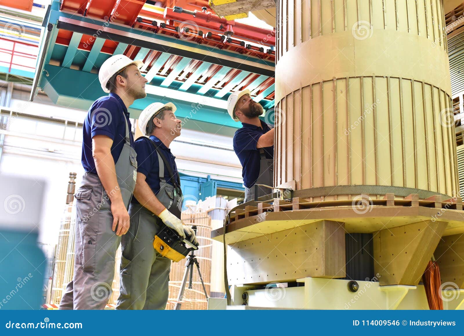Group Worker Assembles a Transformer in Mechanical Engineering - Stock ...