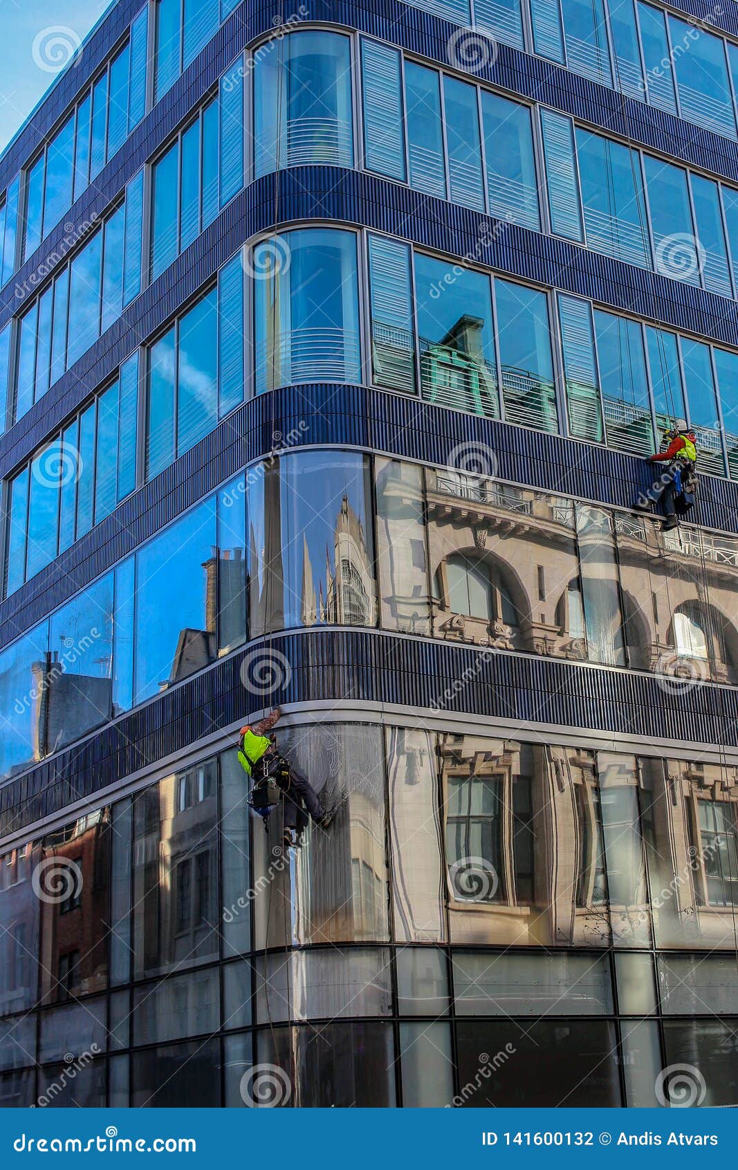 Group of Workers Cleaning Windows Service on High Rise Building Stock ...
