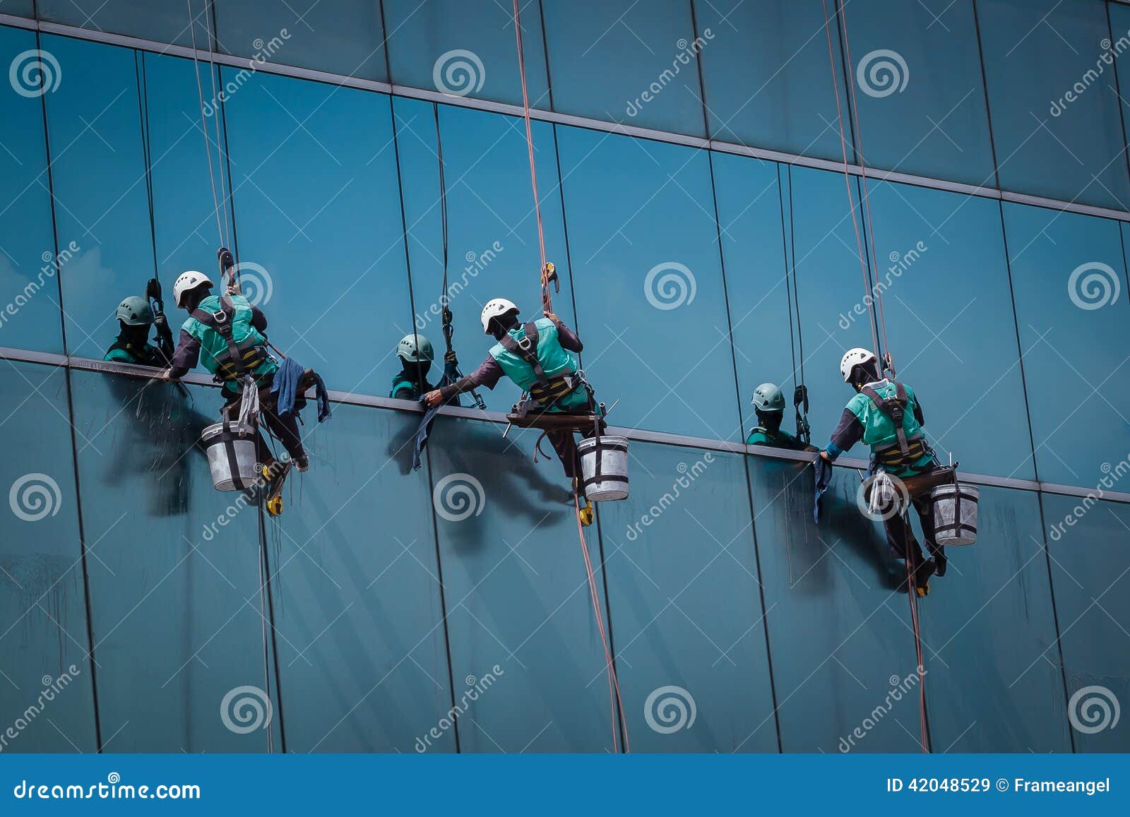 Group of Workers Cleaning Windows Service on High Rise Building Stock ...