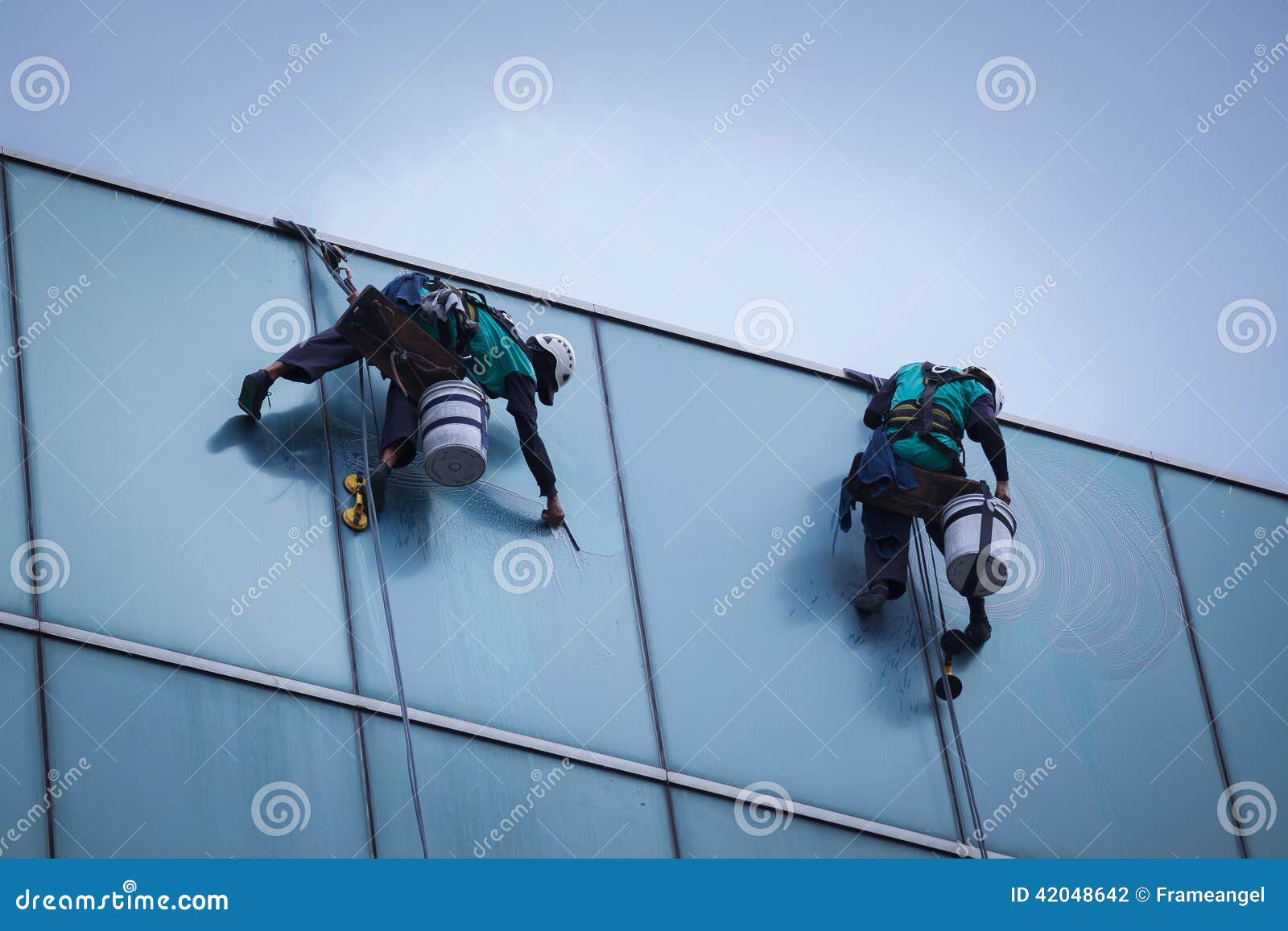 Group of Workers Cleaning Windows Service on High Rise Building Stock ...
