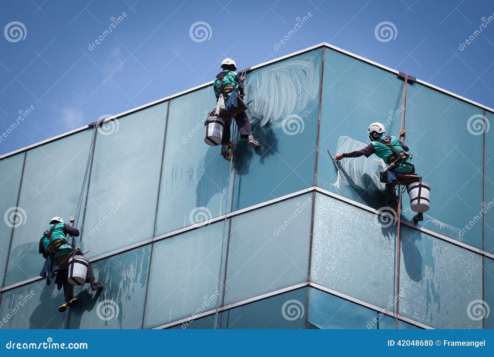 Group of Workers Cleaning Windows Service on High Rise Building Stock ...