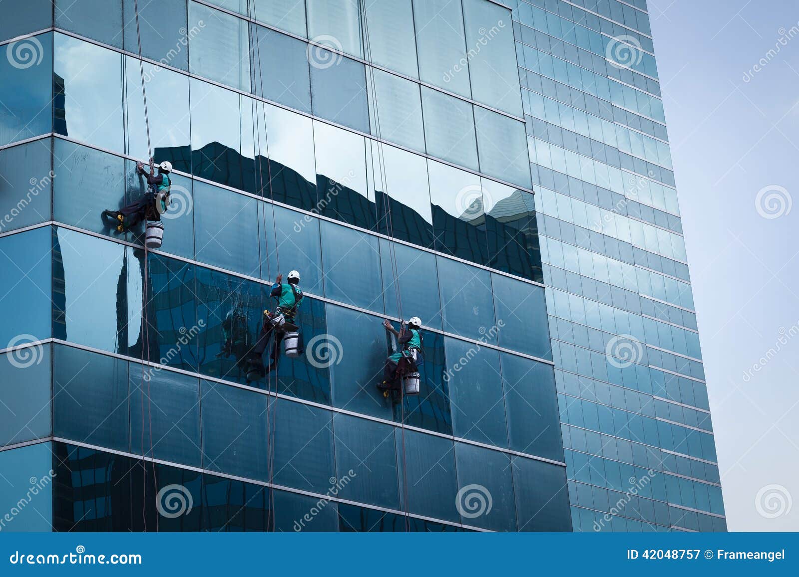 Group of Workers Cleaning Windows Service on High Rise Building Stock ...