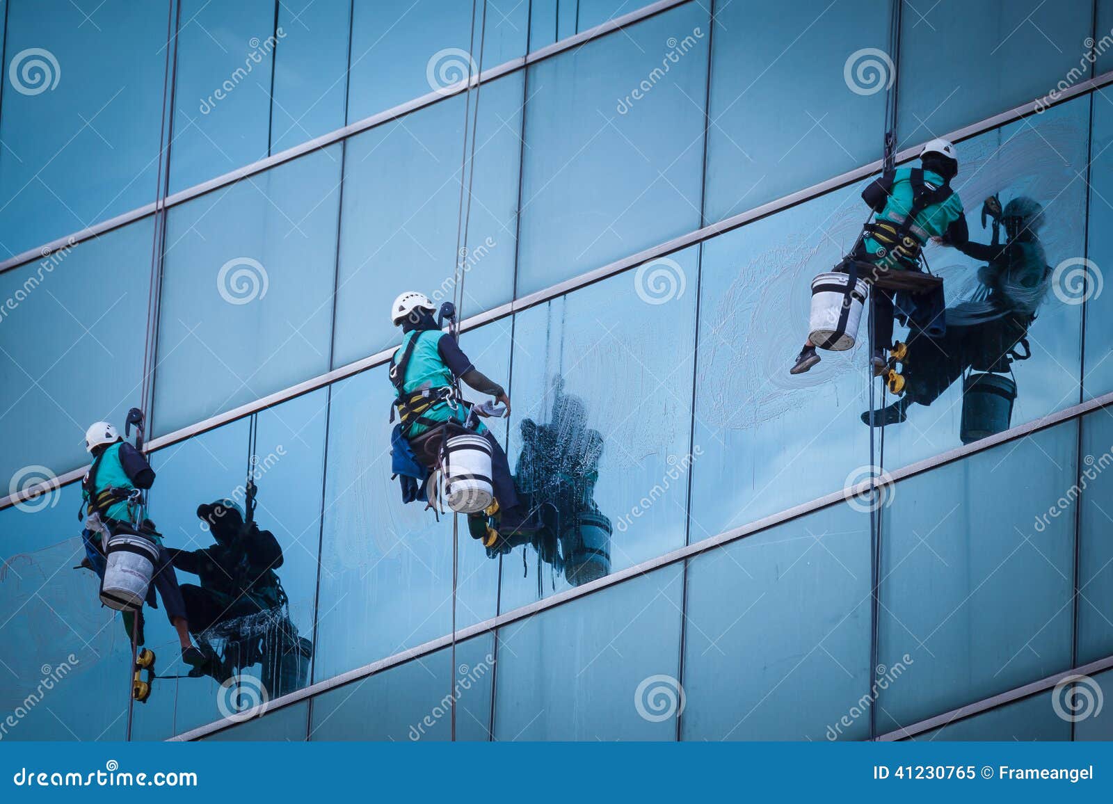 Group of Workers Cleaning Windows Service on High Rise Building Stock ...