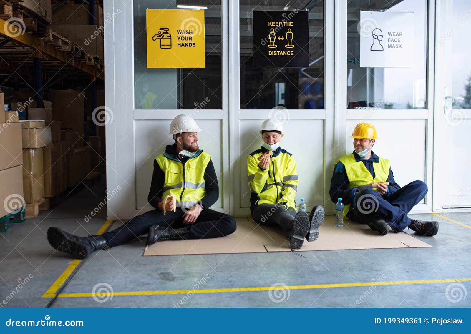 Group of Workers Eating Snack Indoors in Warehouse, Coronavirus Concept ...