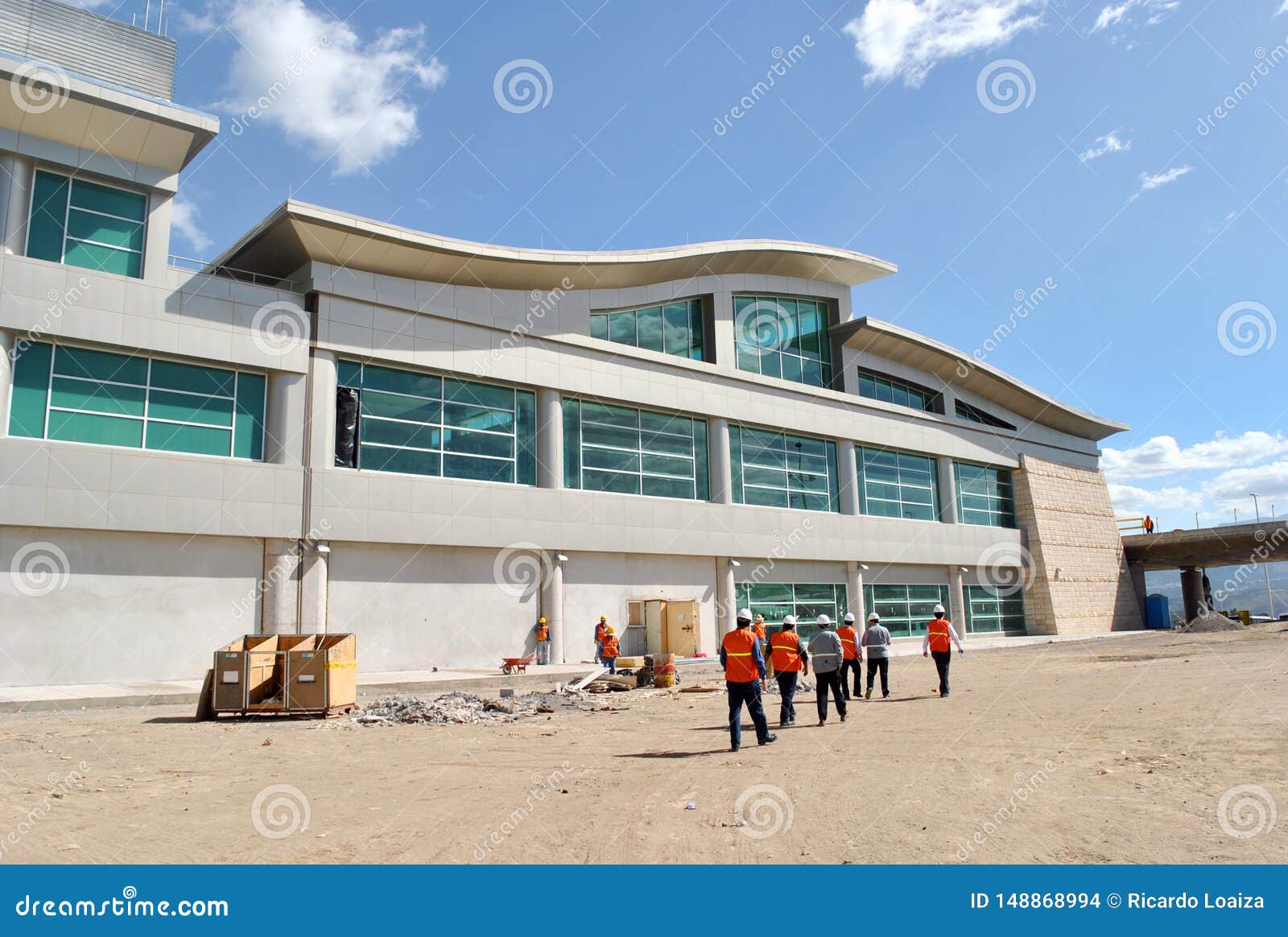 Group of Workers, Architects and Builders Entering a Construction ...