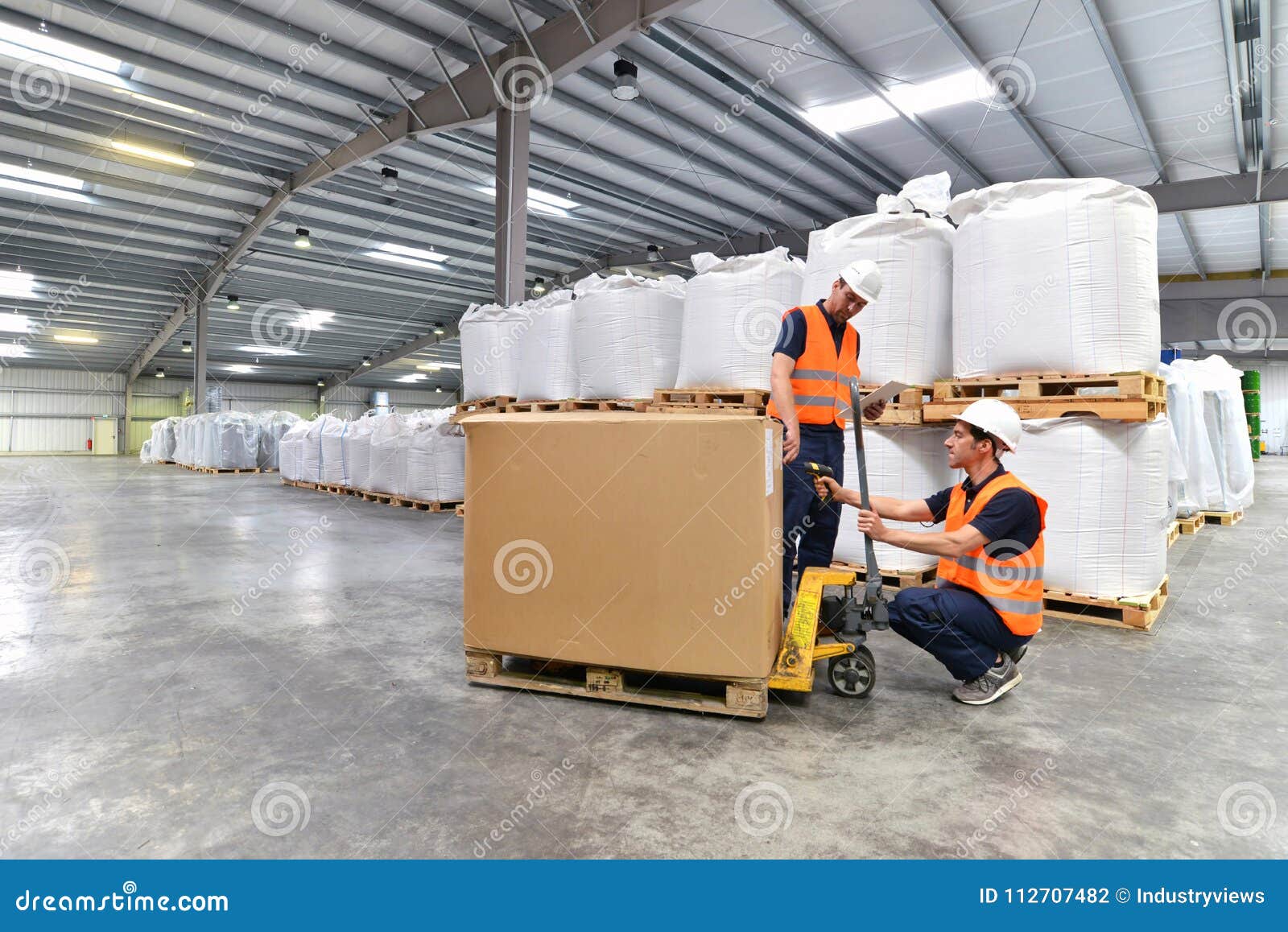 Group of Workers in the Logistics Industry - Scanning Barcode Stock ...
