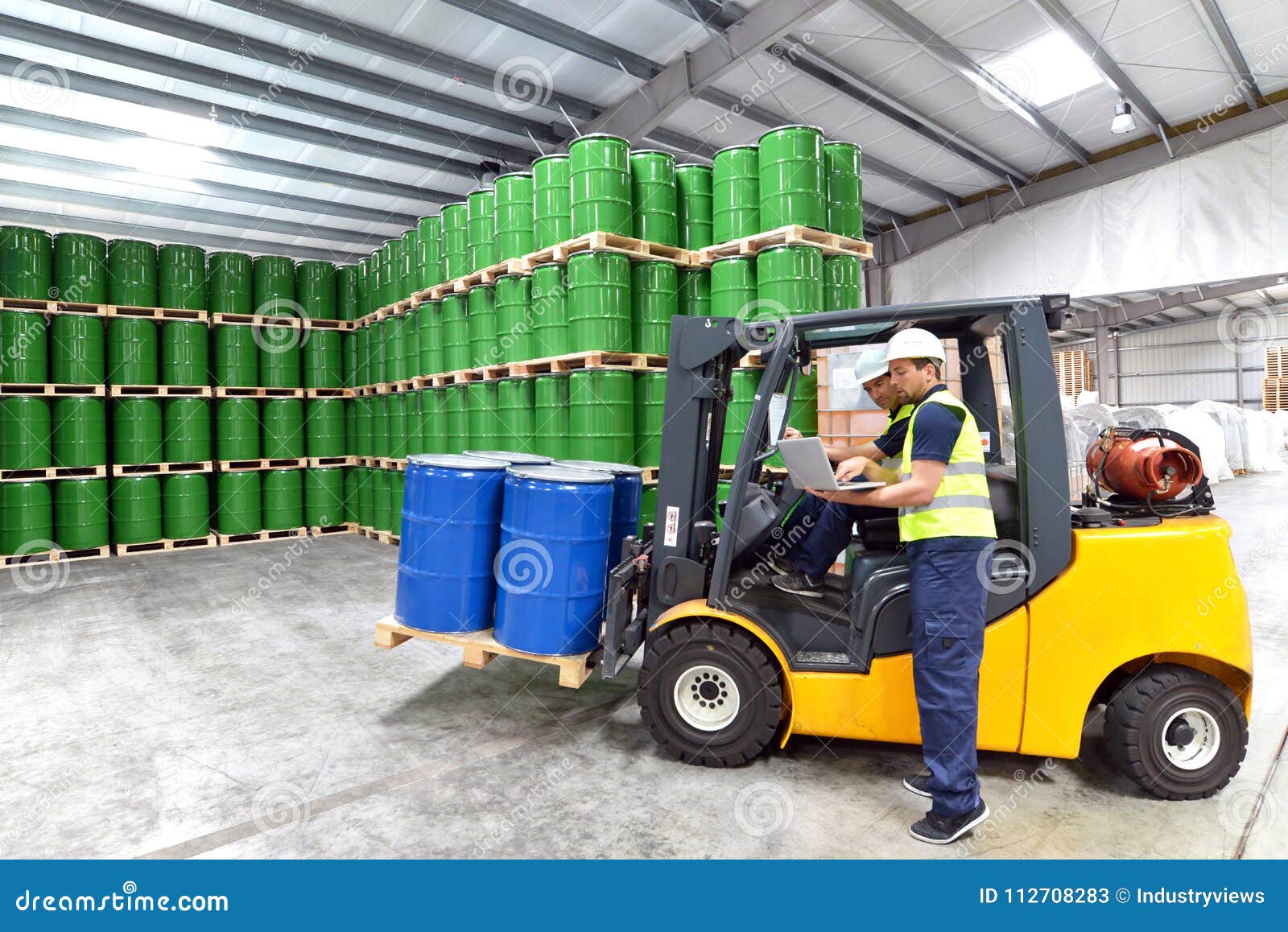 Group of Workers in the Logistics Industry Work in a Warehouse W Stock ...