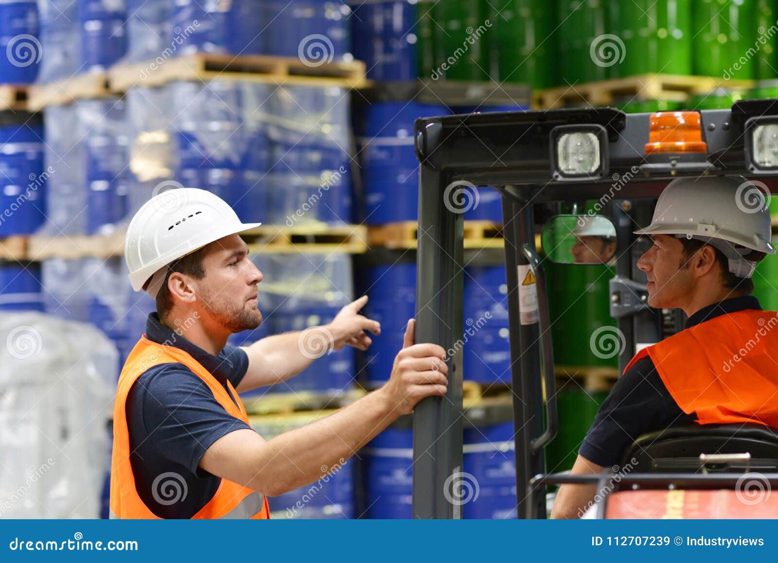 Group of Workers in the Logistics Industry Work in a Warehouse W Stock ...