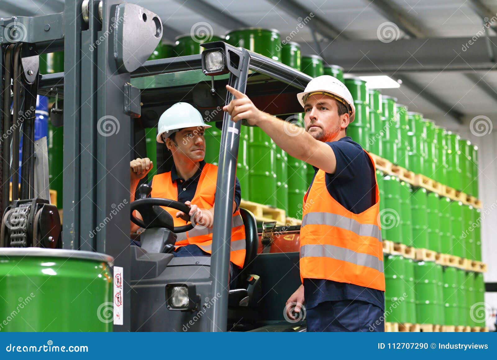 Group of Workers in the Logistics Industry Work in a Warehouse W Stock ...