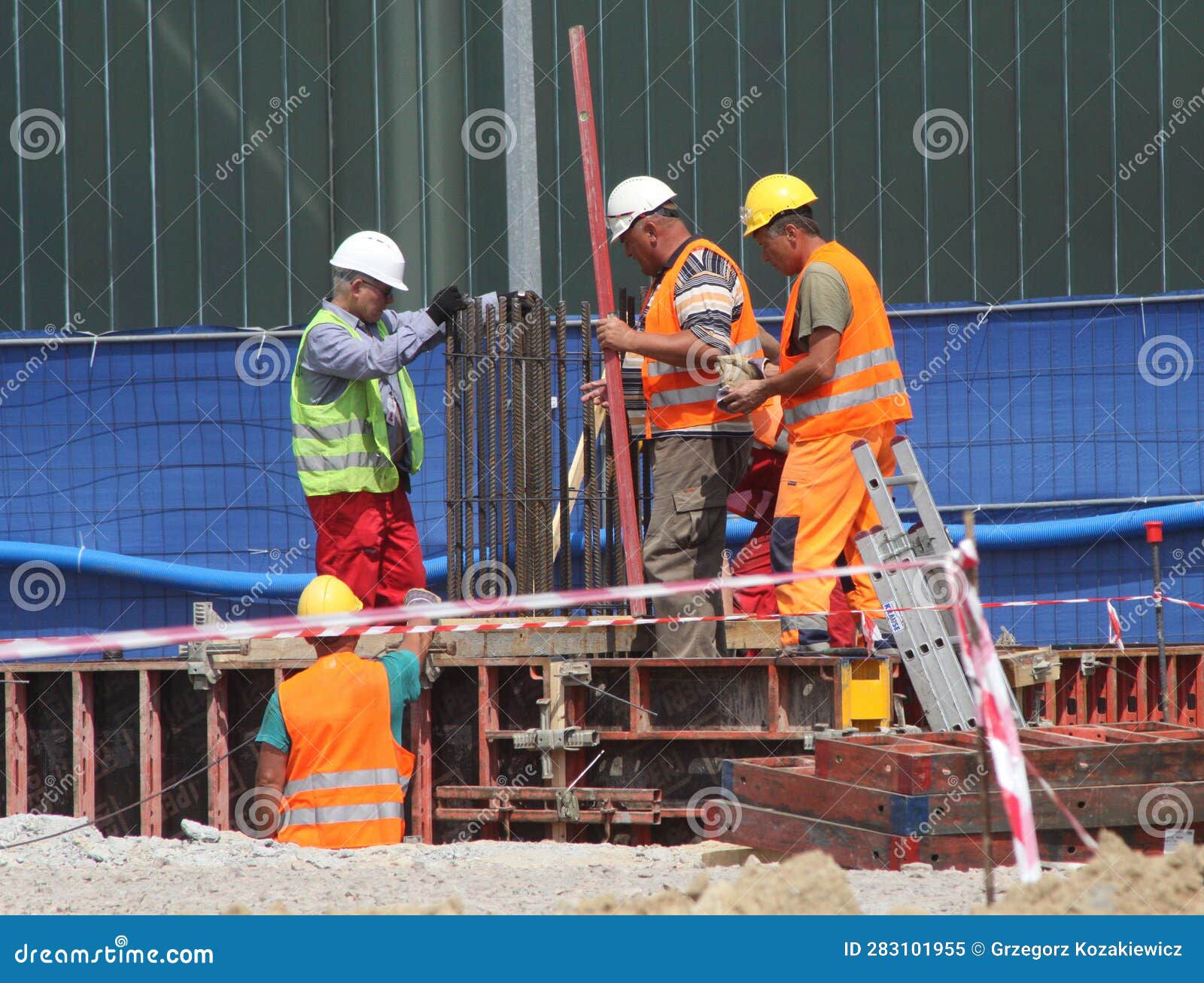 Group of Workers Mounting Steel Reinforcement Editorial Image - Image ...