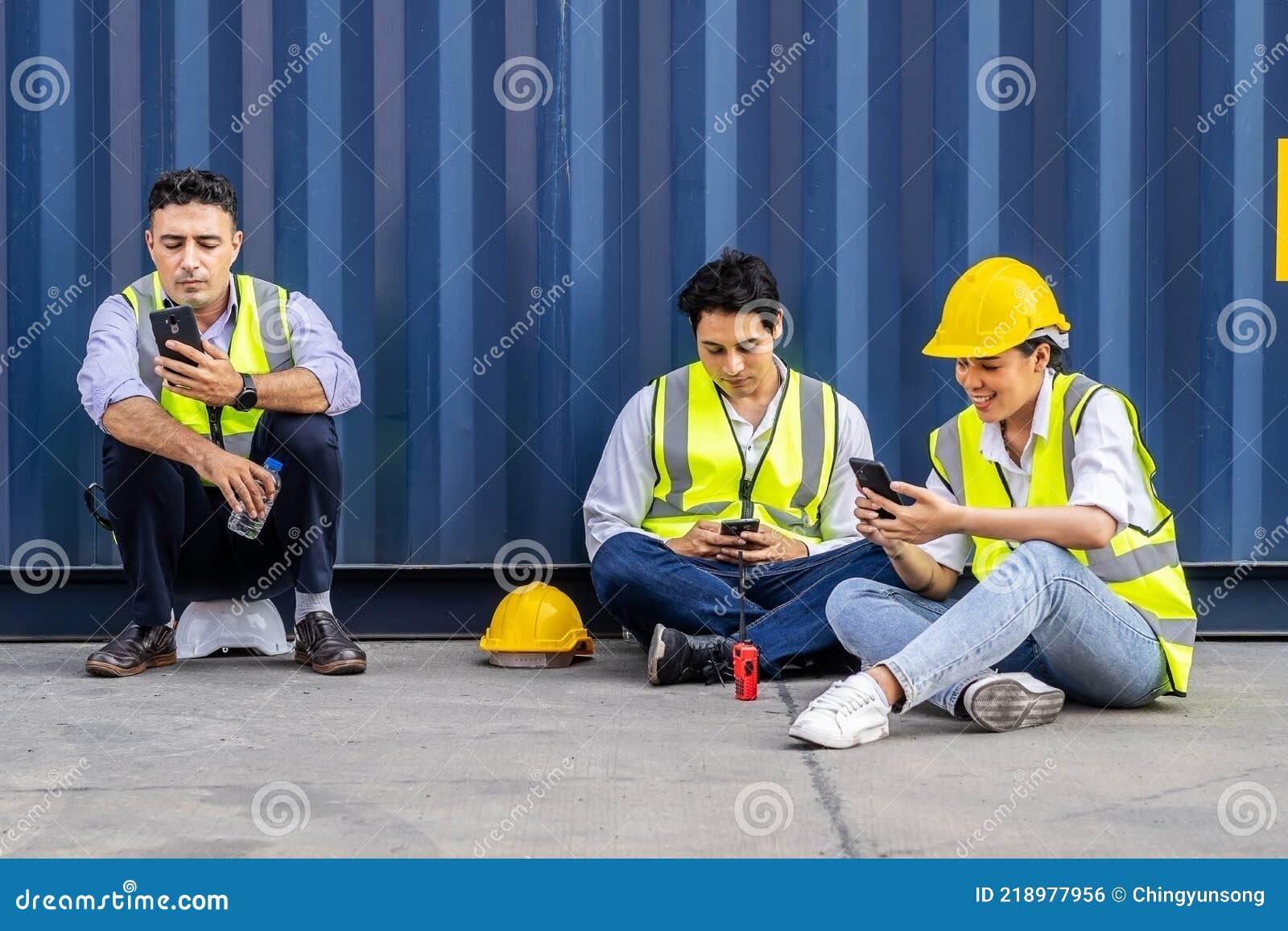 Group of Workers Playing, Online Chatting or Browsing on Mobile Phone ...