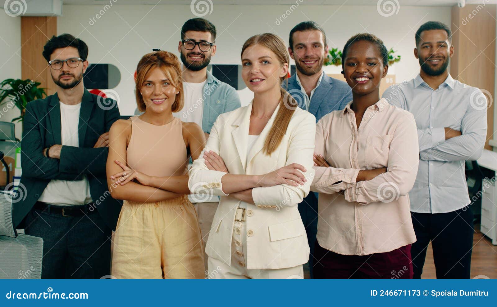 A Group of Workers are Staring Directly at the Camera while Having ...
