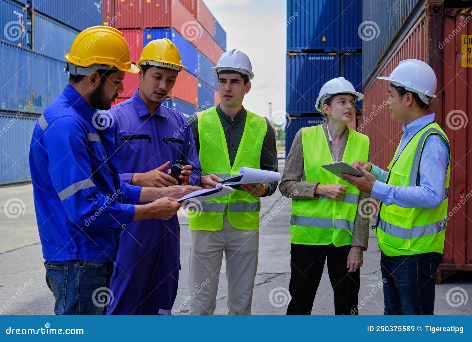 Group of Workers Teamwork at Logistics Terminal with Many Stacks of ...