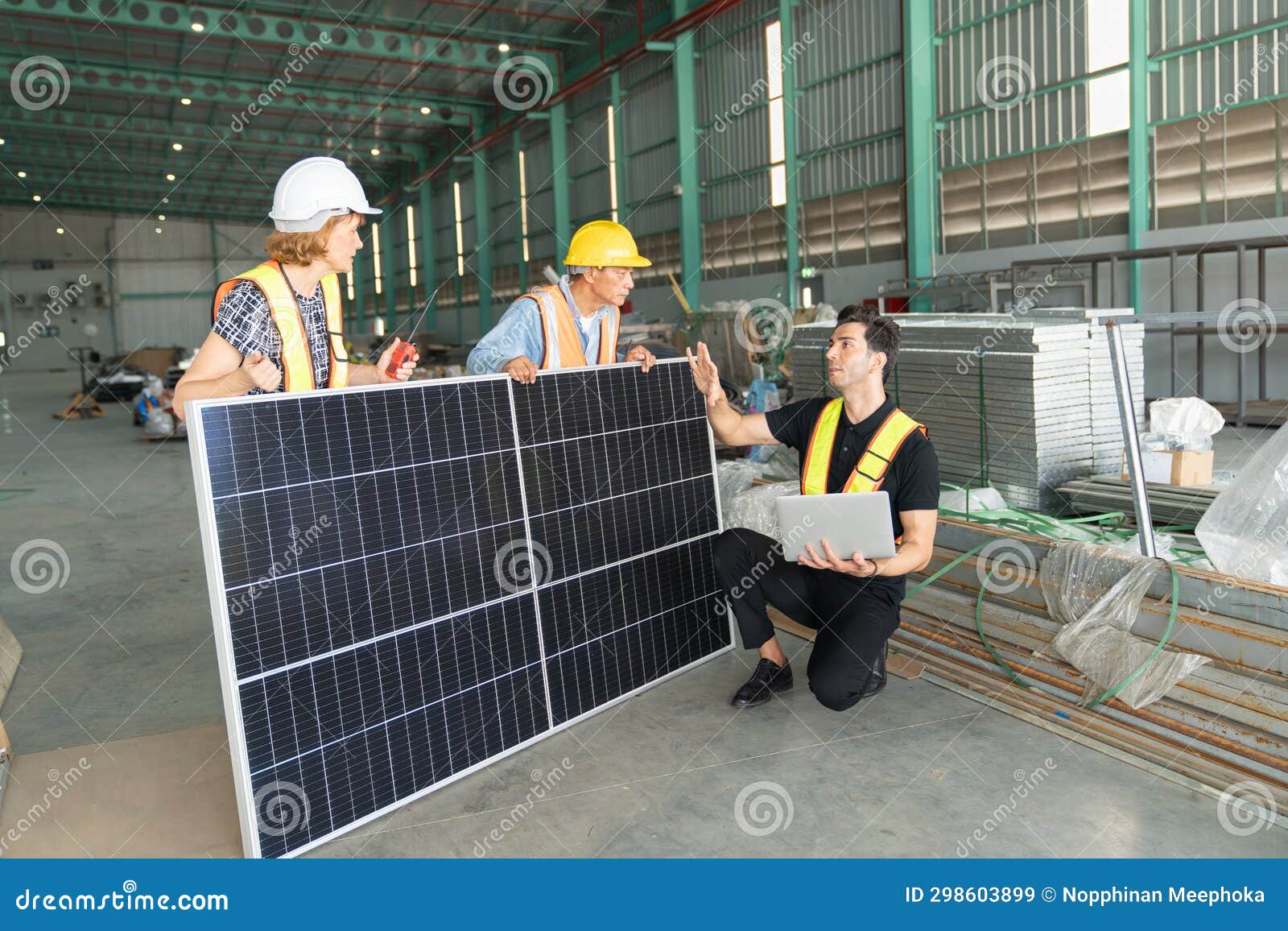 Group of Workers Using Solar Panels in Warehouse. Stock Image - Image ...