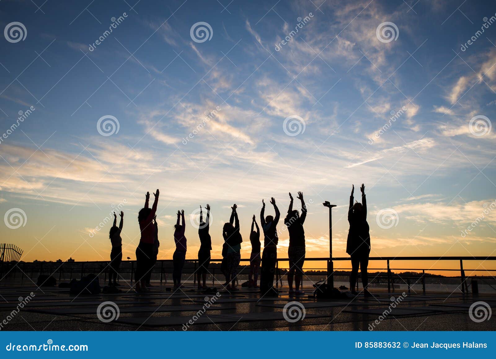 Group yoga at sunrise stock photo. Image of group, exercise - 85883632