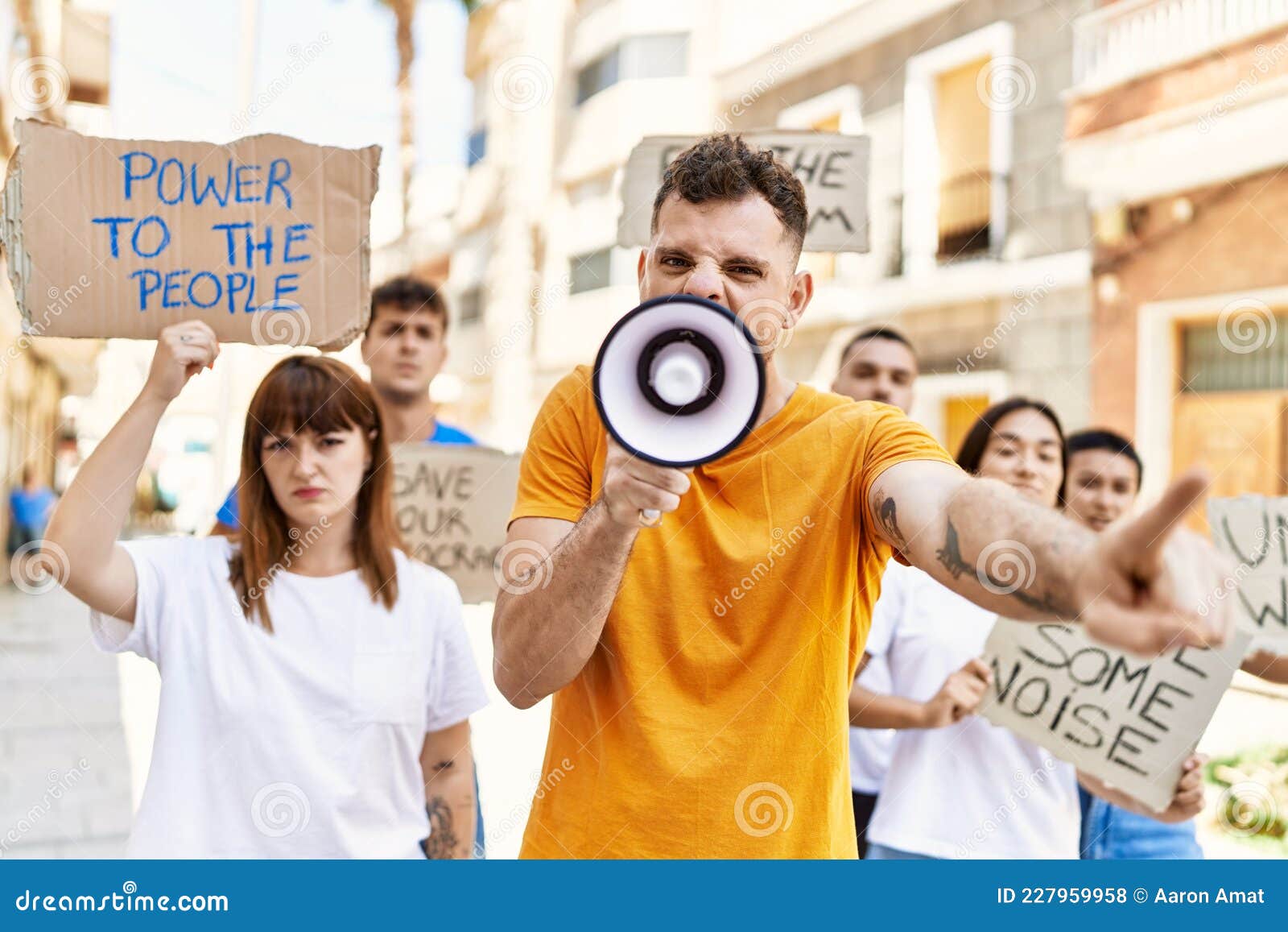Group of Young Activists Protesting Holding Banner and Using Megaphone ...