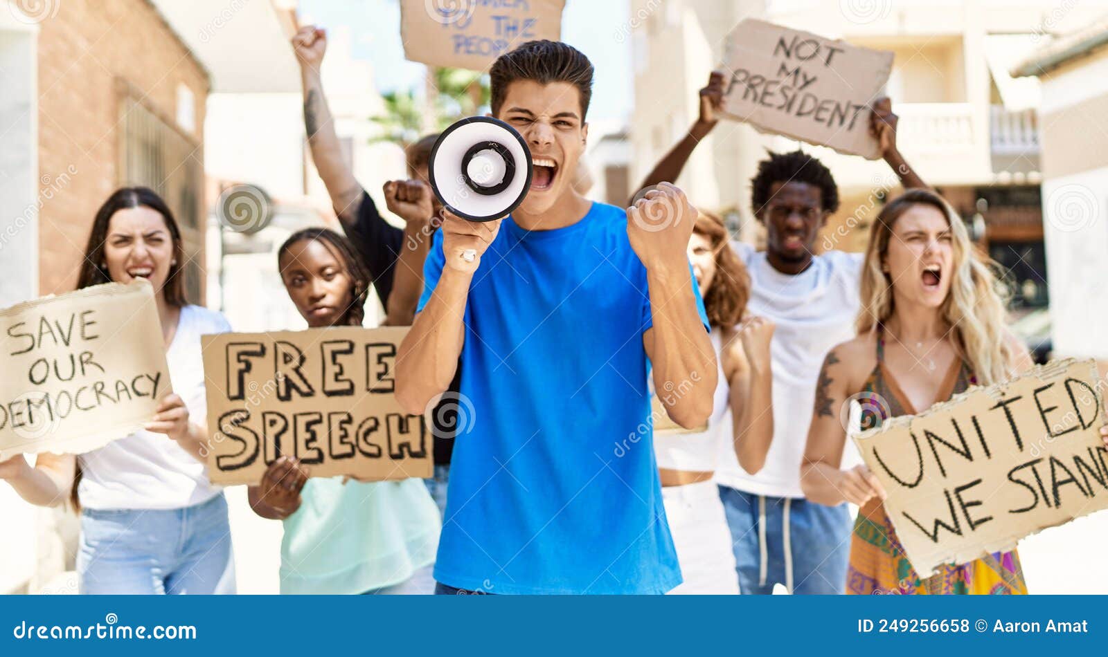 Group of Young Activists Protesting Holding Banner and Using Megaphone ...