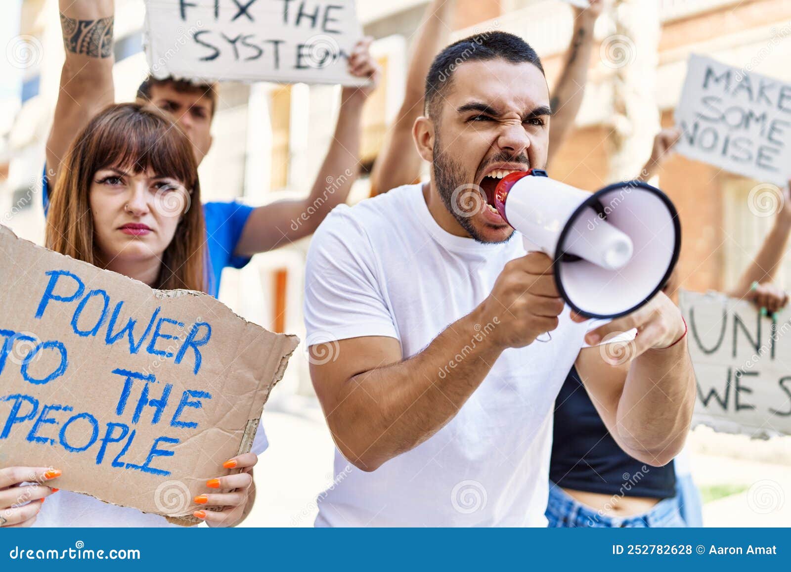 Group of Young Activists Protesting Holding Banner and Using Megaphone ...