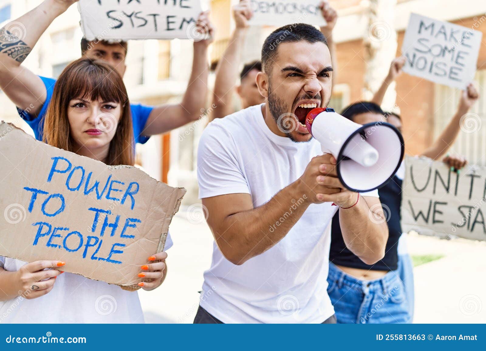 Group of Young Activists Protesting Holding Banner and Using Megaphone ...