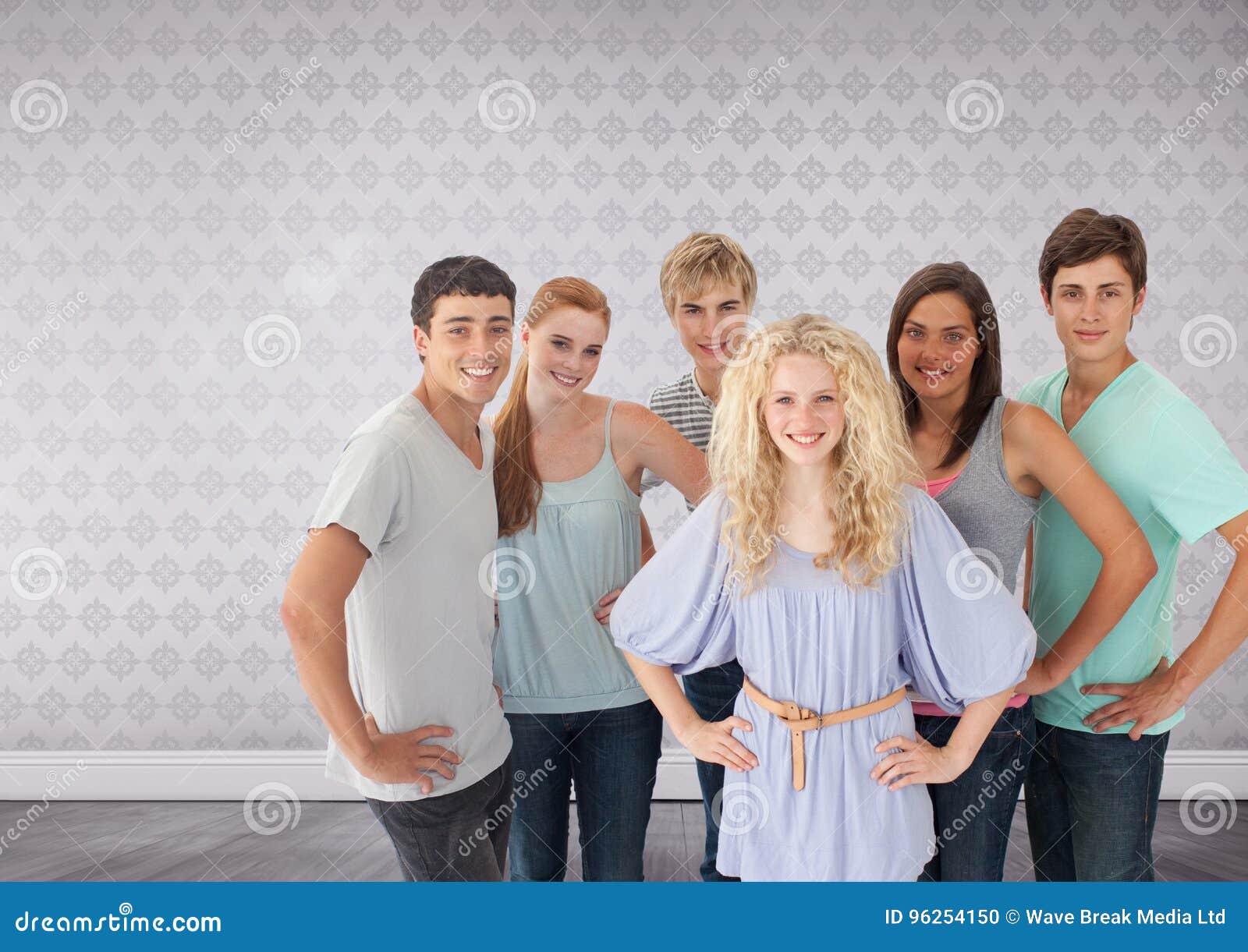 Group of Young Adults Standing in Front of Bright Wallpaper Background ...