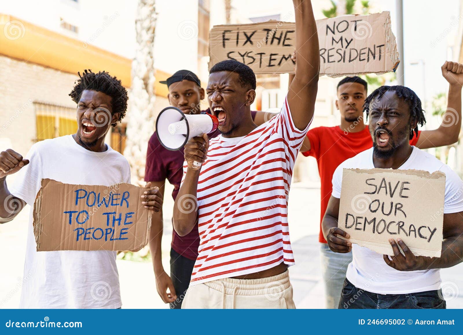 Group of Young African American Activists Protesting Holding Banner and ...