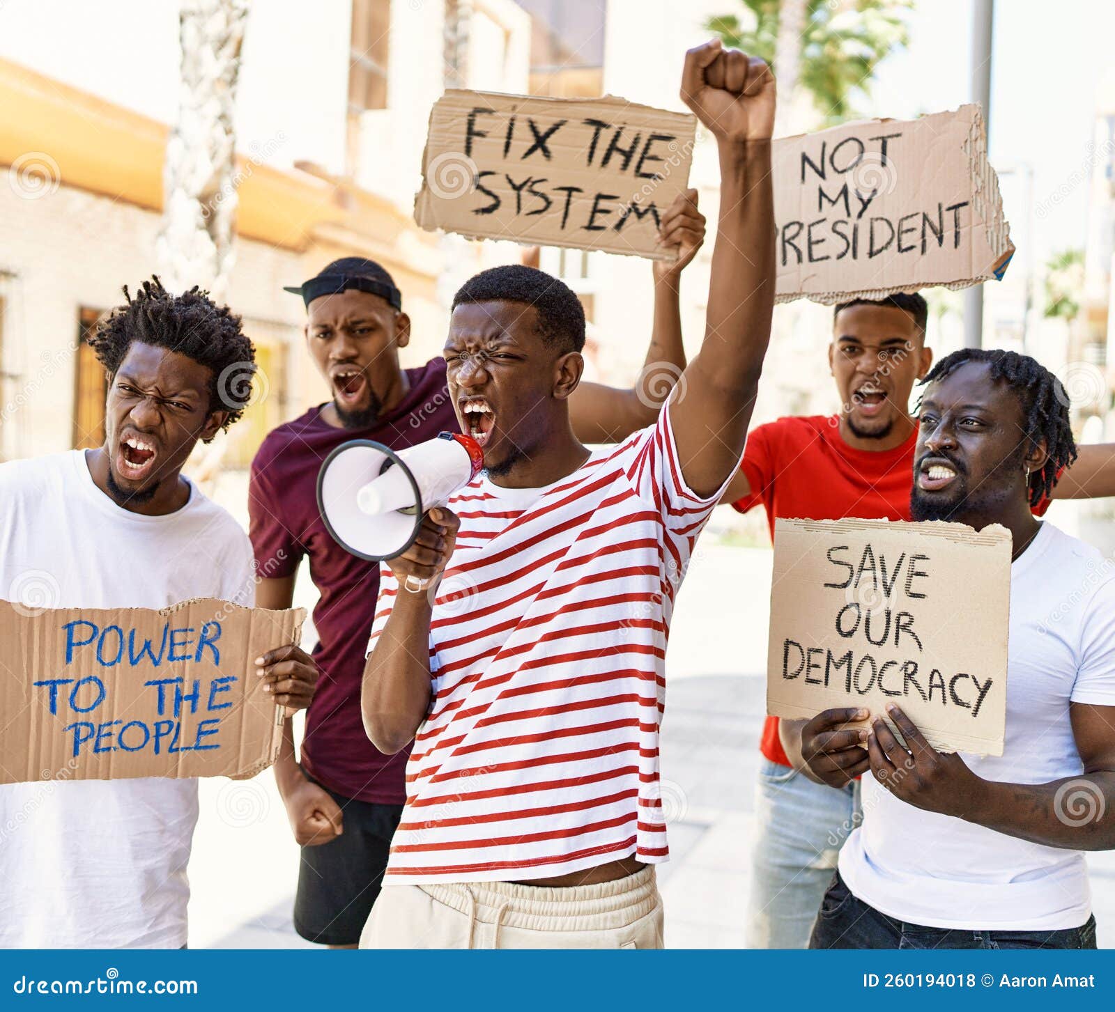 Group of Young African American Activists Protesting Holding Banner and ...