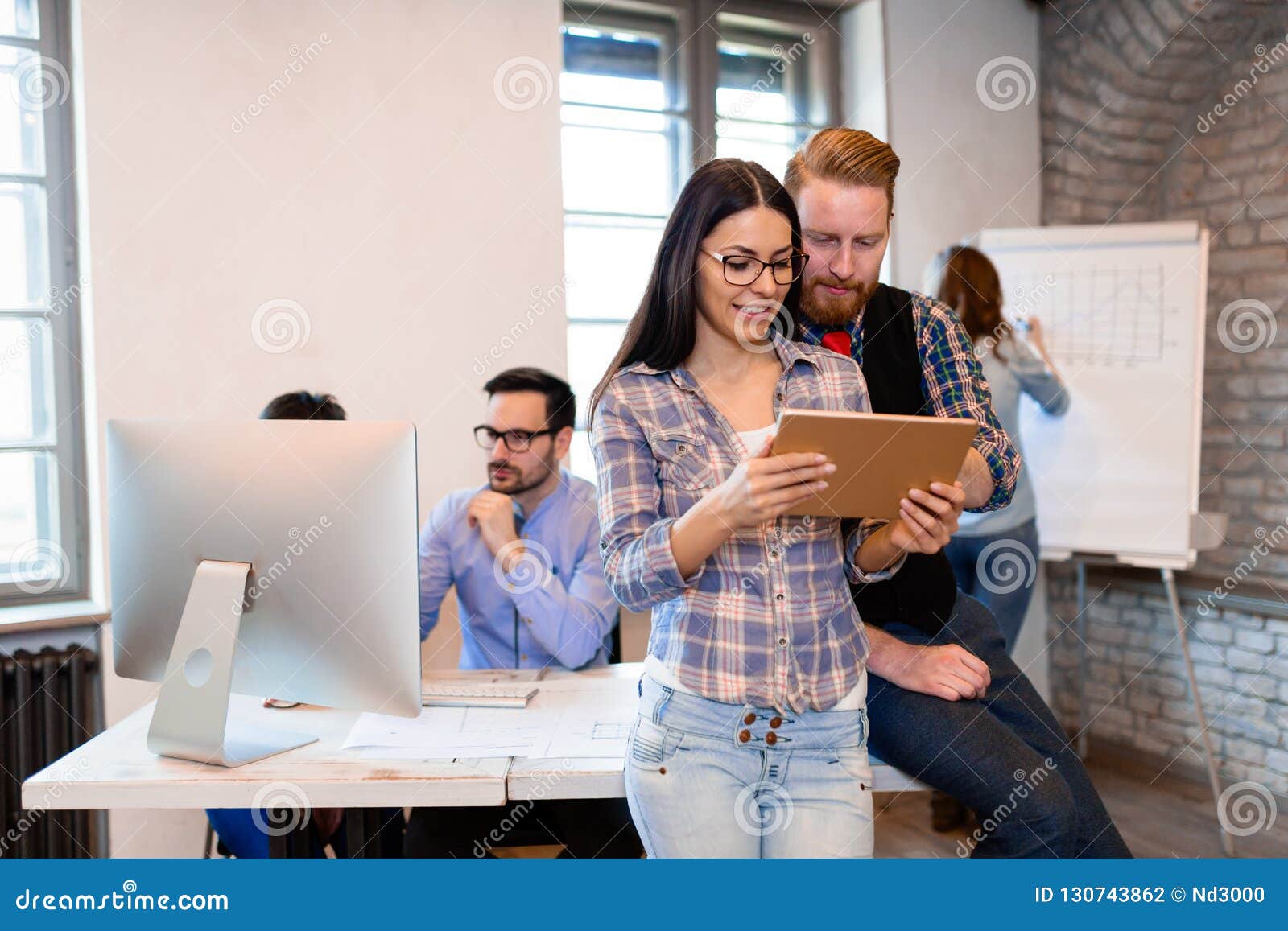 Group of Young Architects Using Digital Tablet Stock Photo - Image of ...