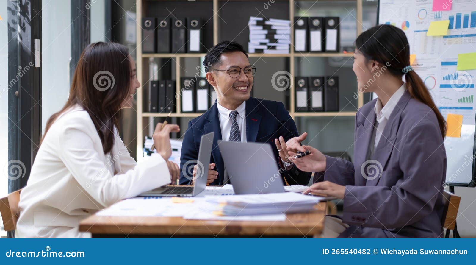 Group of Young Asian Modern People in Smart Casual Wear Having a ... Group of Young Asian Modern People in Smart Casual Wear Having a ...