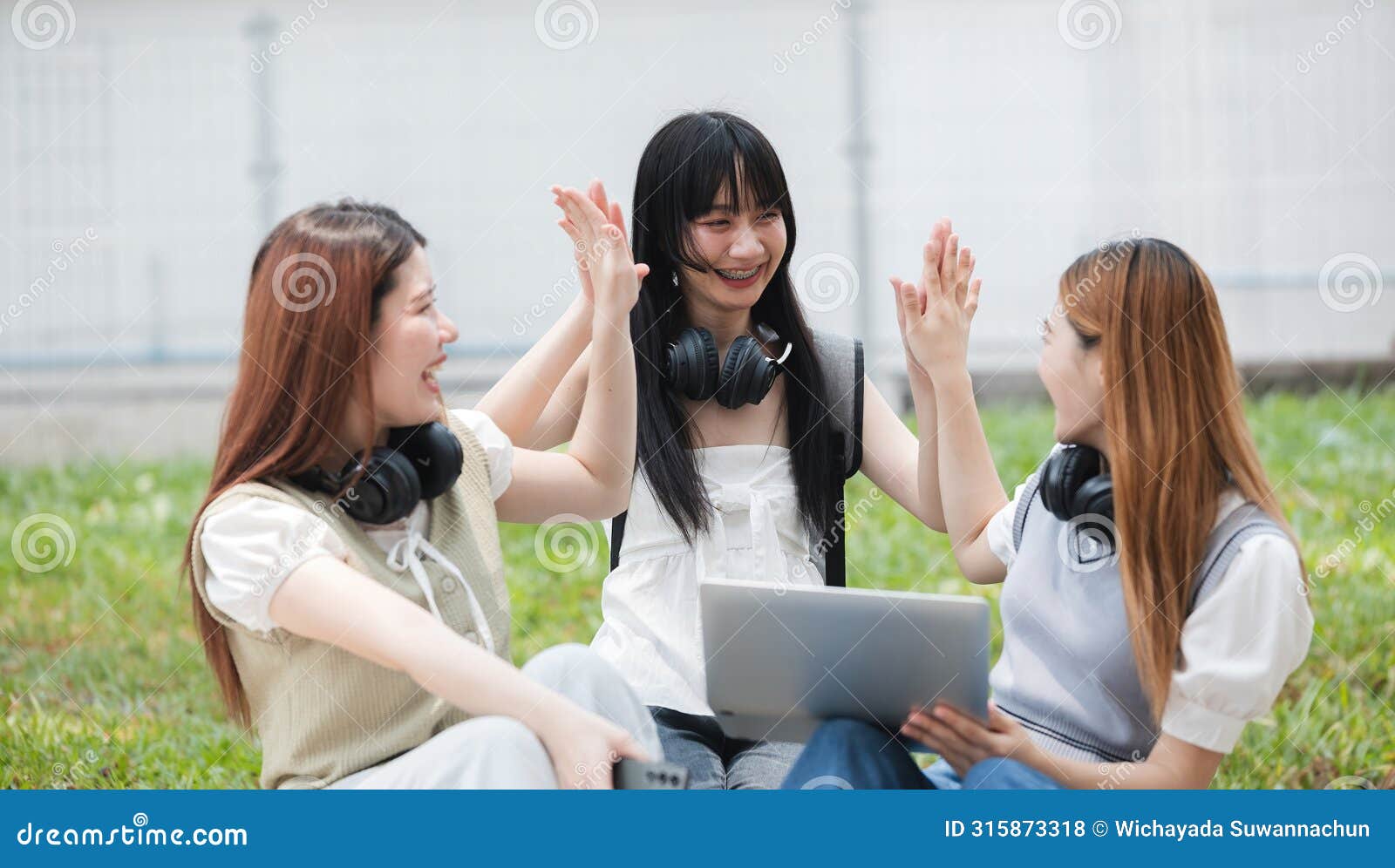 Group of Young Asian Students Collaborating Outdoors at University ...
