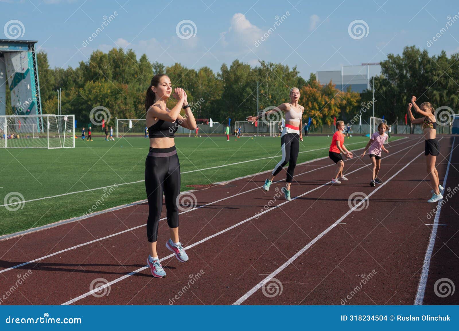 Group of Young Athletes Training at the Stadium Stock Photo - Image of ...