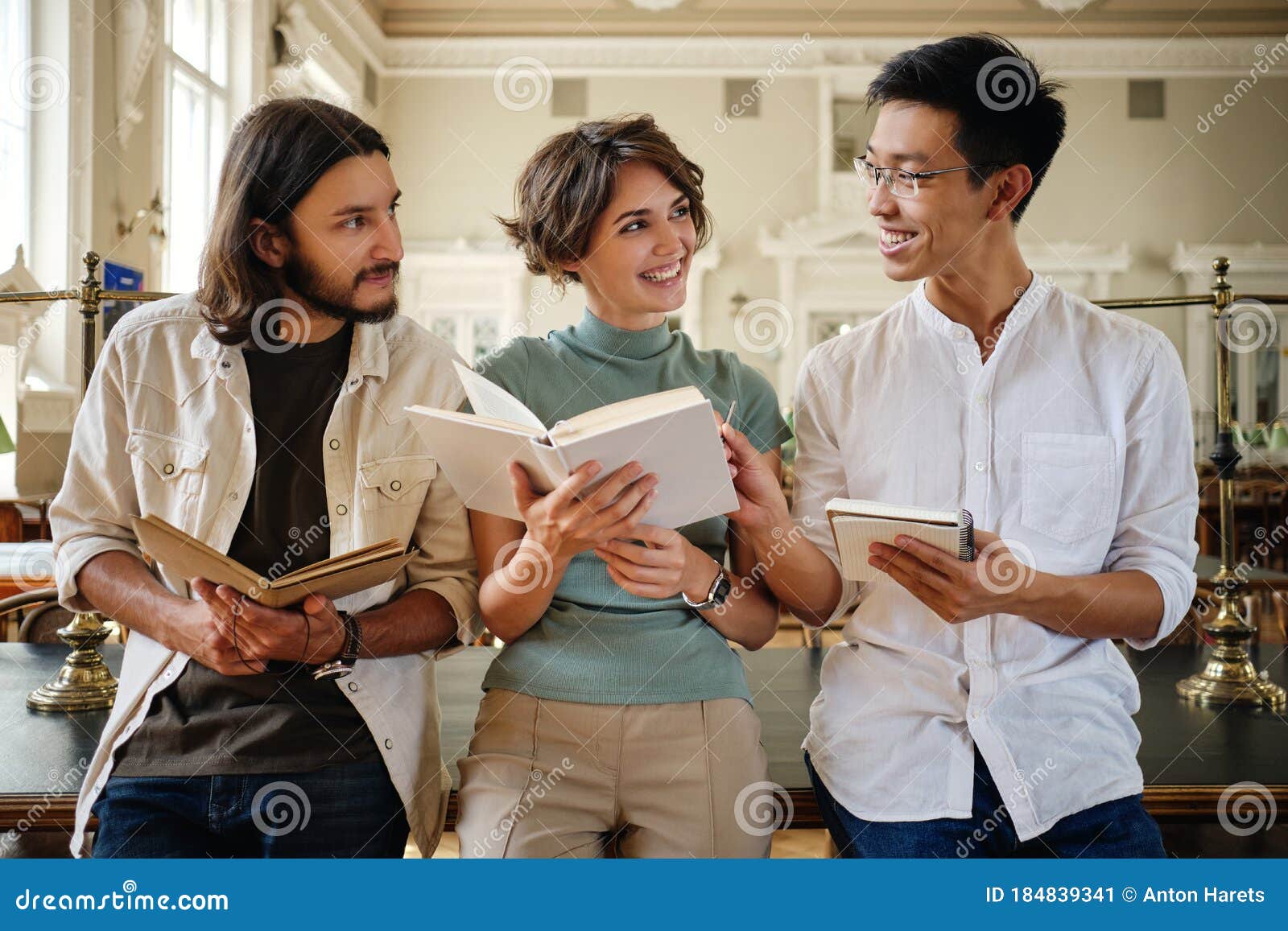 Group of Young Attractive Multinational Students Happily Studying in ...