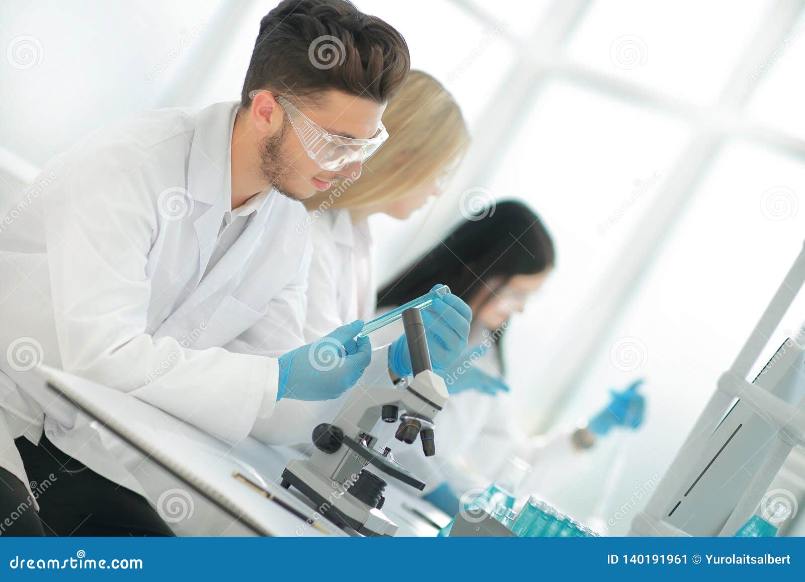 Group of Young Biologists Sitting at the Laboratory Table Stock Image ...