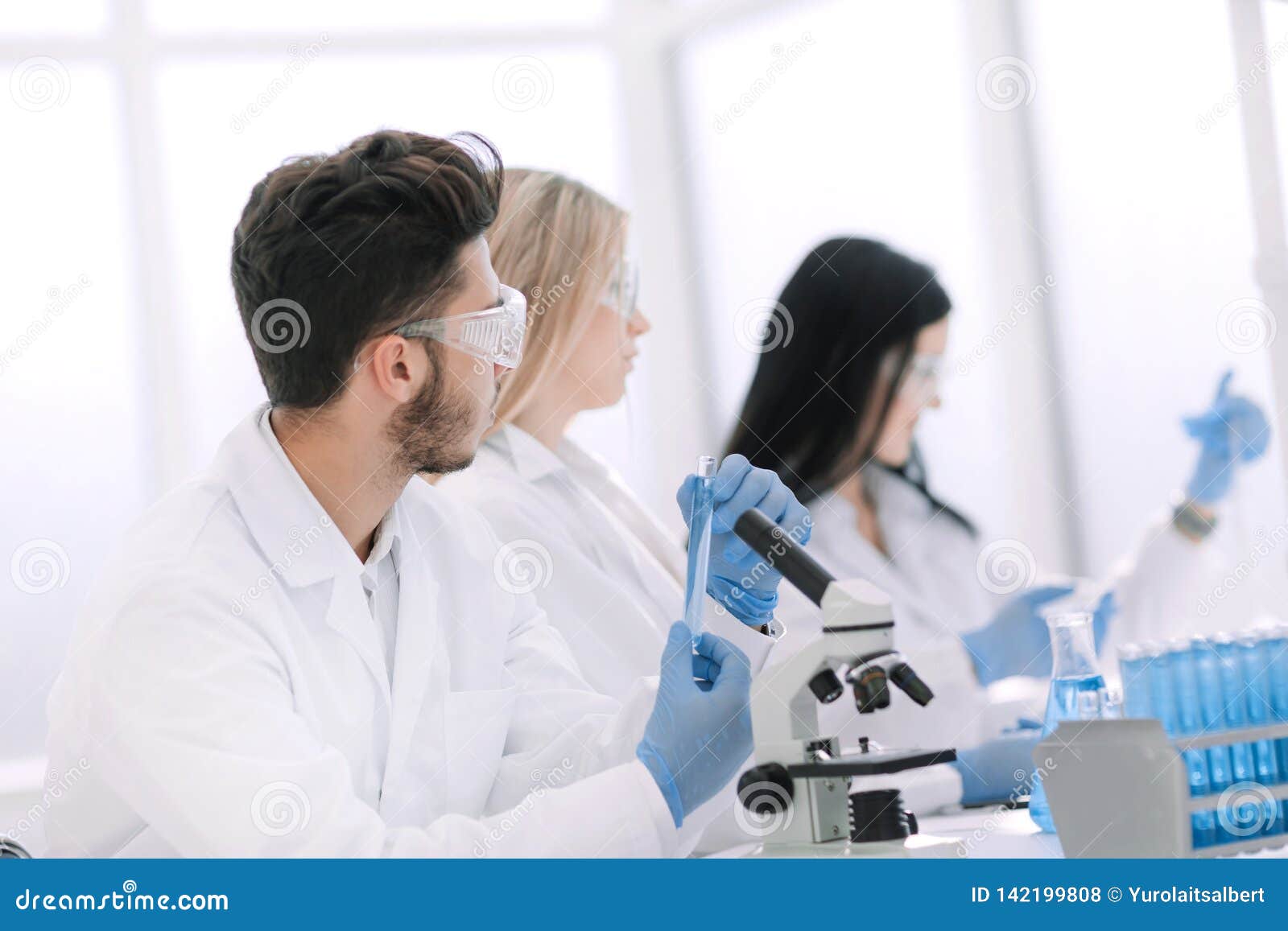 Group of Young Biologists Sitting at the Laboratory Table Stock Photo ...