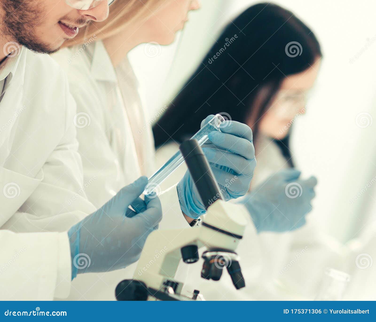 Group of Young Biologists Sitting at the Laboratory Table Stock Photo ...