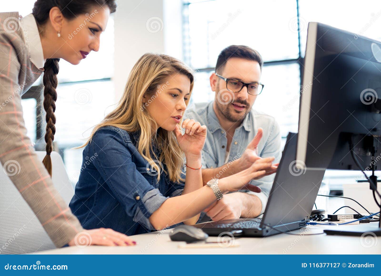 Group of Business People and Software Developers Working As a Team in ... Group of Business People and Software Developers Working As a Team in ...