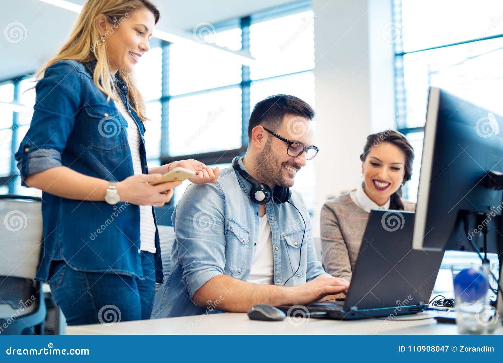 Group of Business People and Software Developers Working As a Team in ... Group of Business People and Software Developers Working As a Team in ...