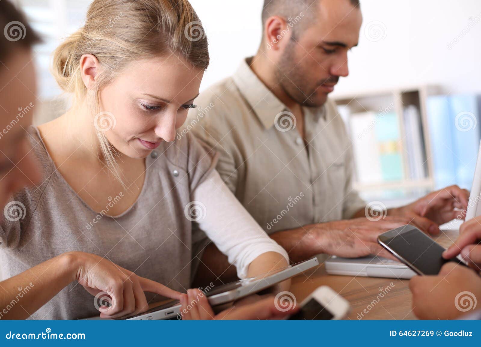 Group of Young Business People Using Electronical Devices Stock Image ...