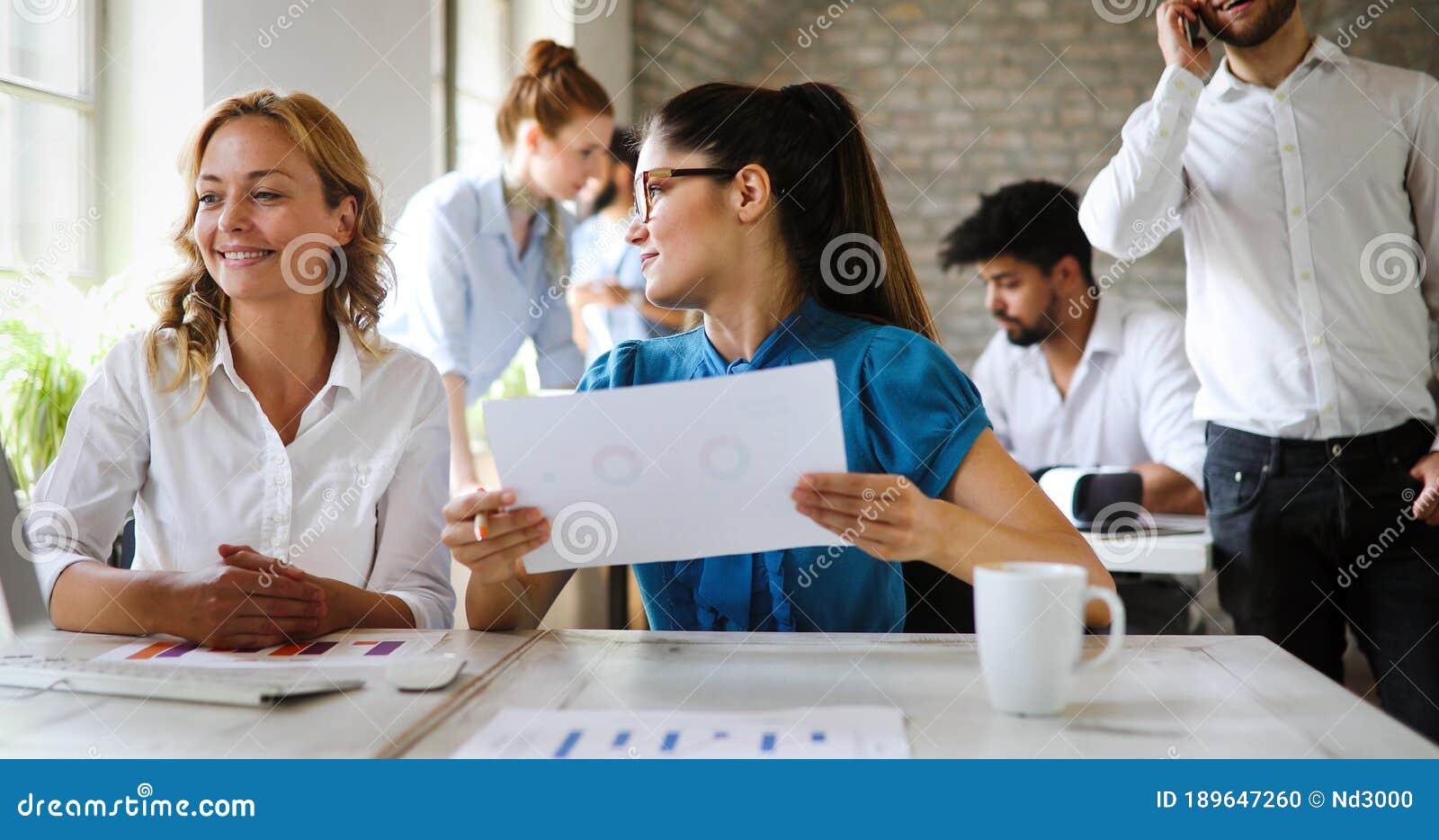 Group of Young Business People Working and Communicating at the Office ...