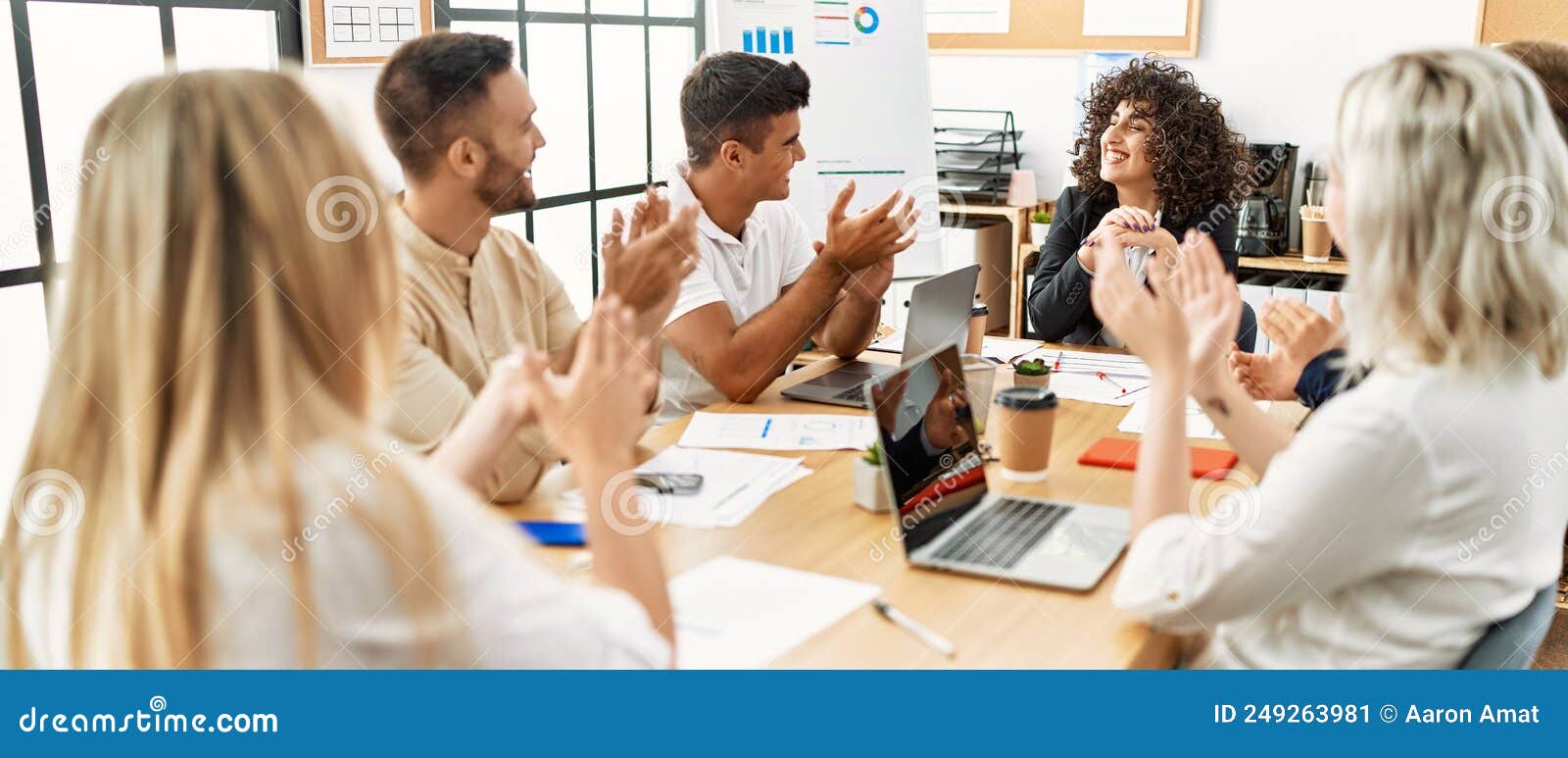 Group of Young Business Workers Smiling and Clapping To Partner at the ...
